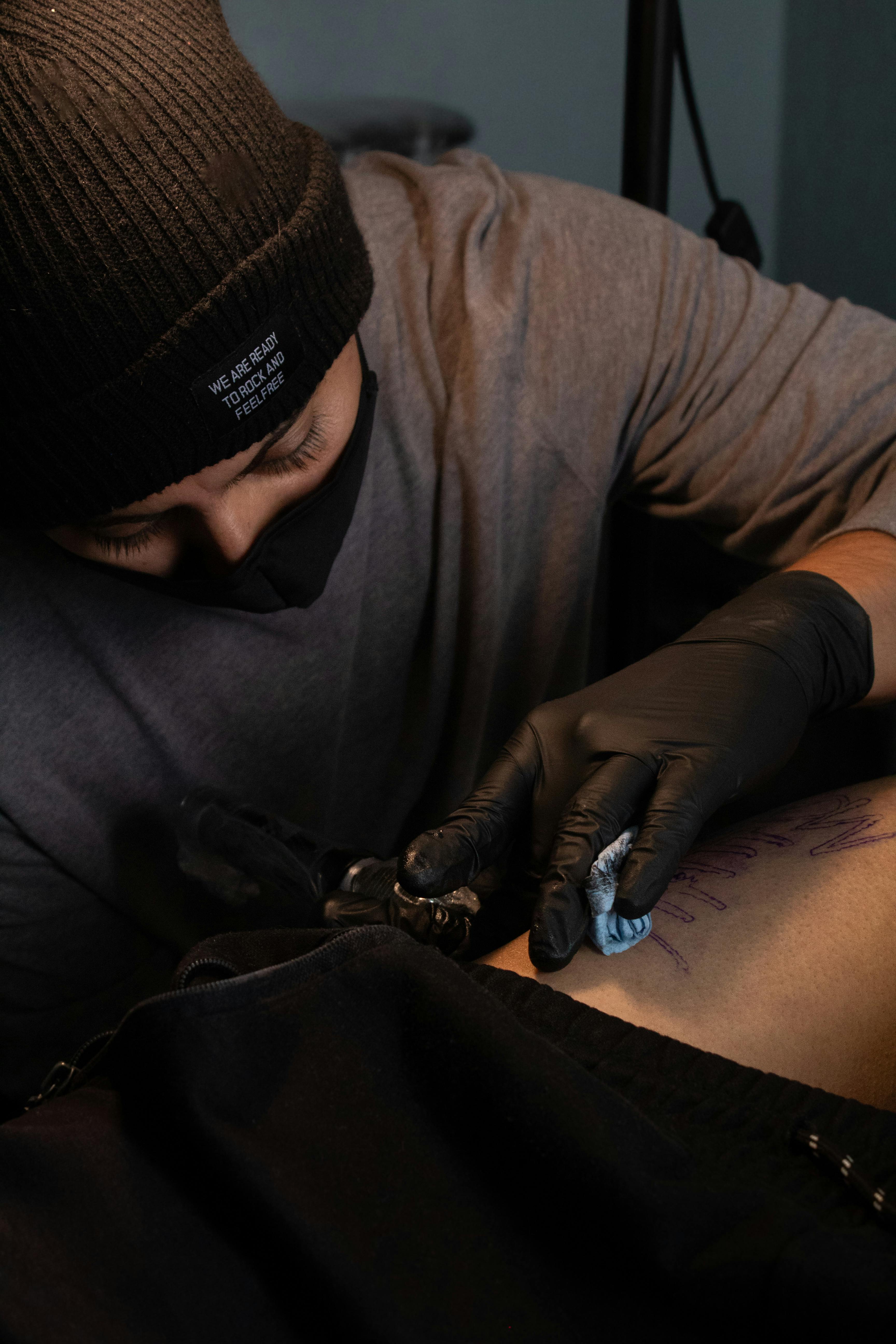 Person Using Tattoo Machine · Free Stock Photo