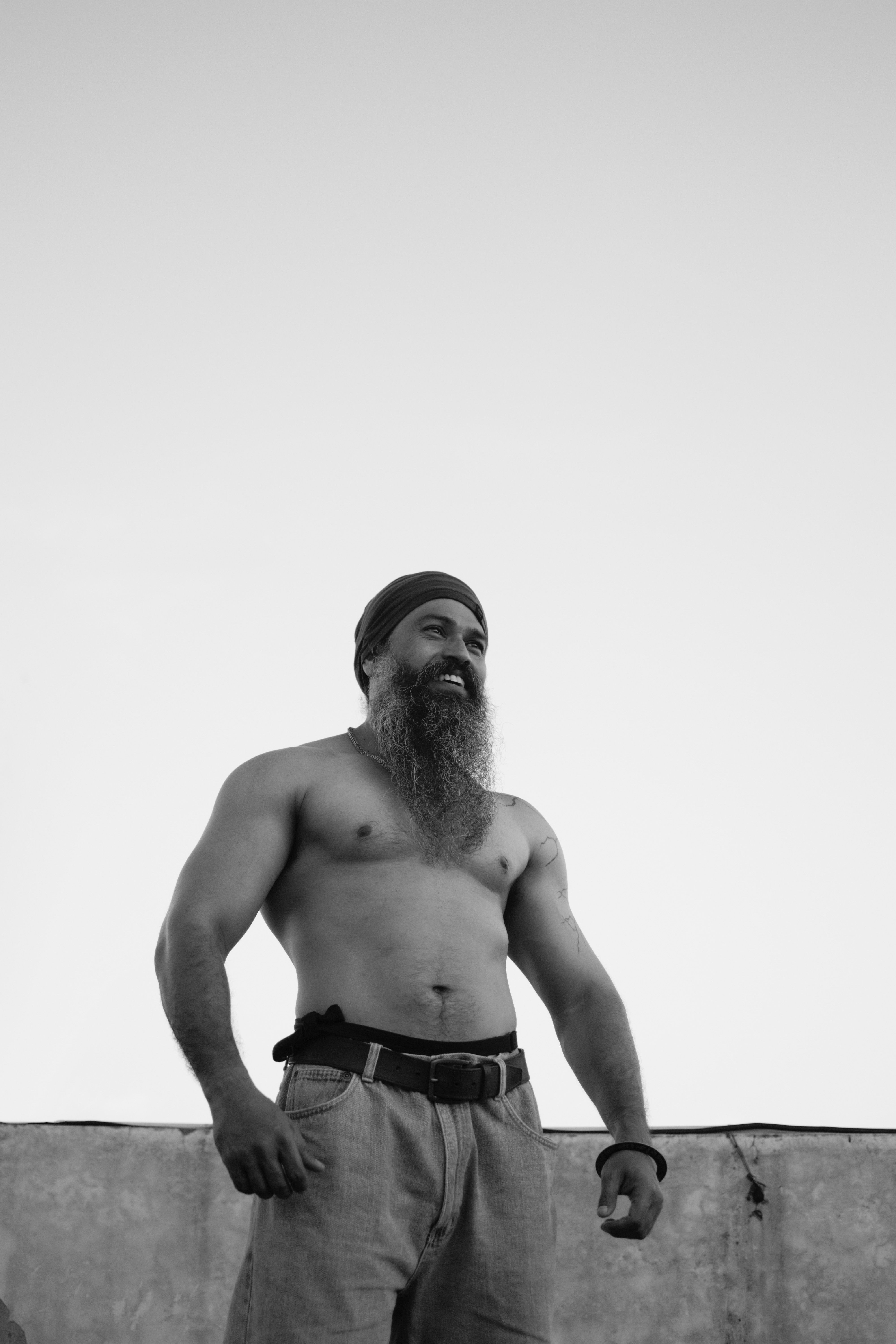 Man Without Shirt by the Shore in Black and White · Free Stock Photo
