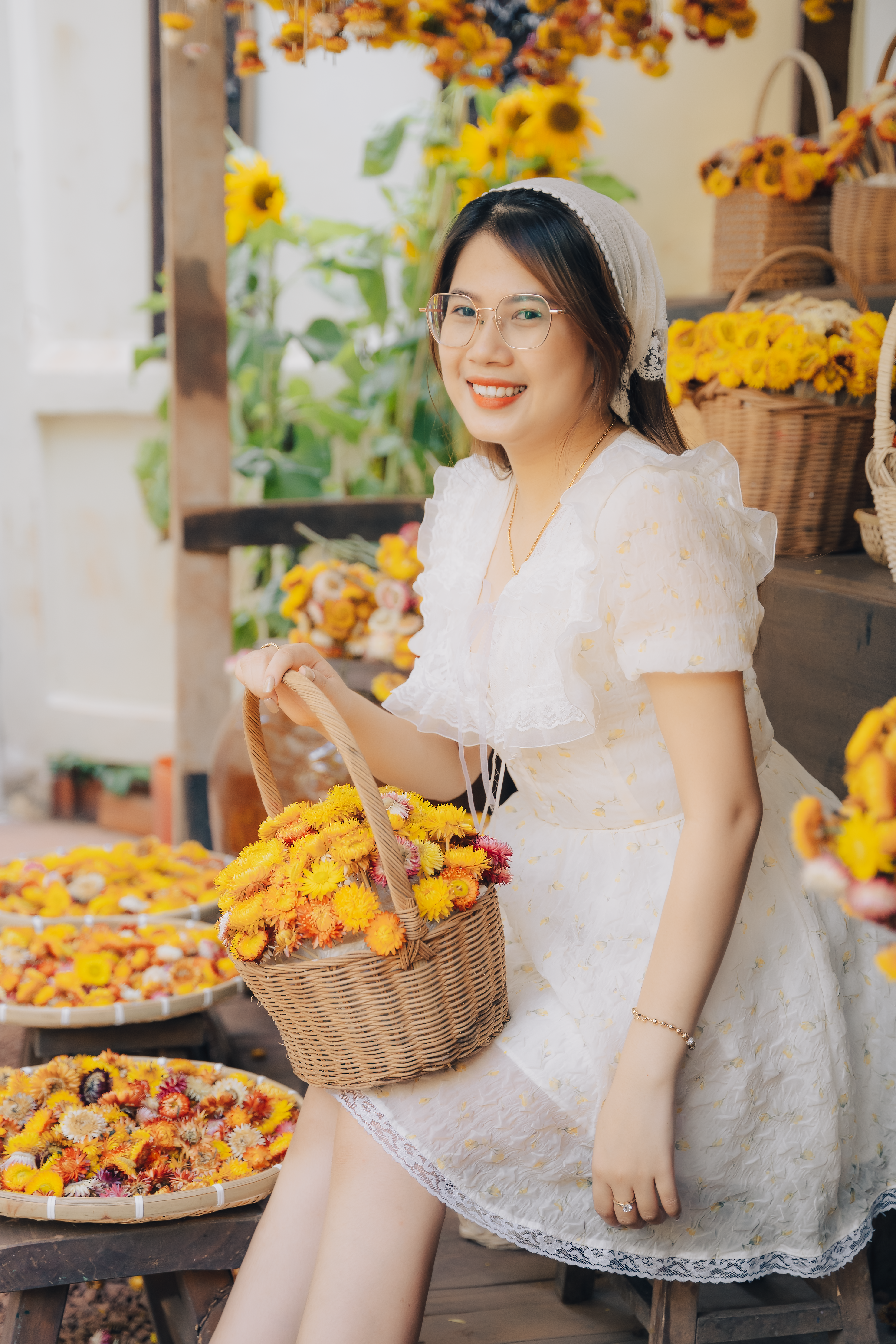 Beautiful Brunette Woman Sitting Around Baskets of Flowers · Free Stock ...