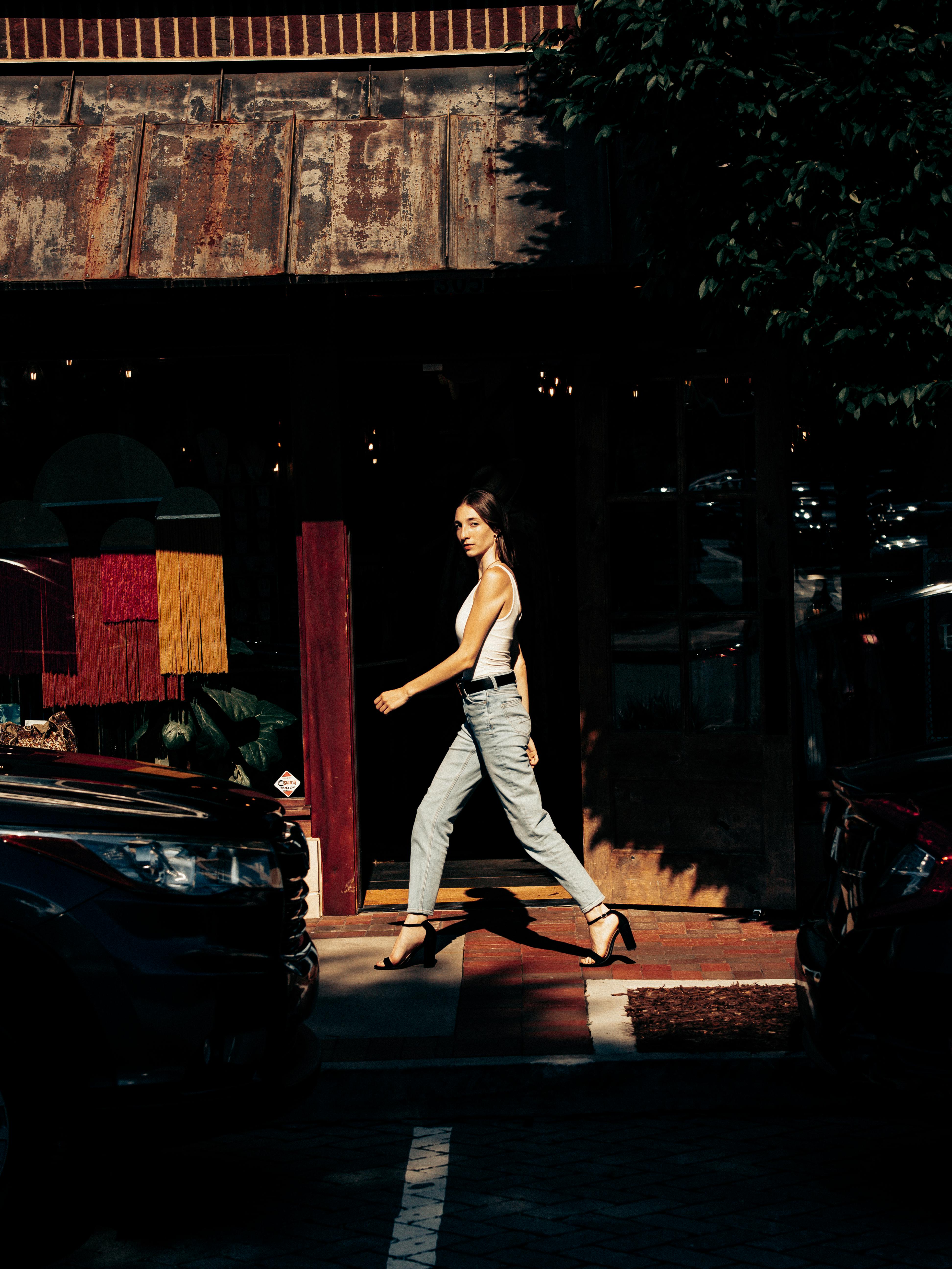 Fashion Model walking in the street · Free Stock Photo