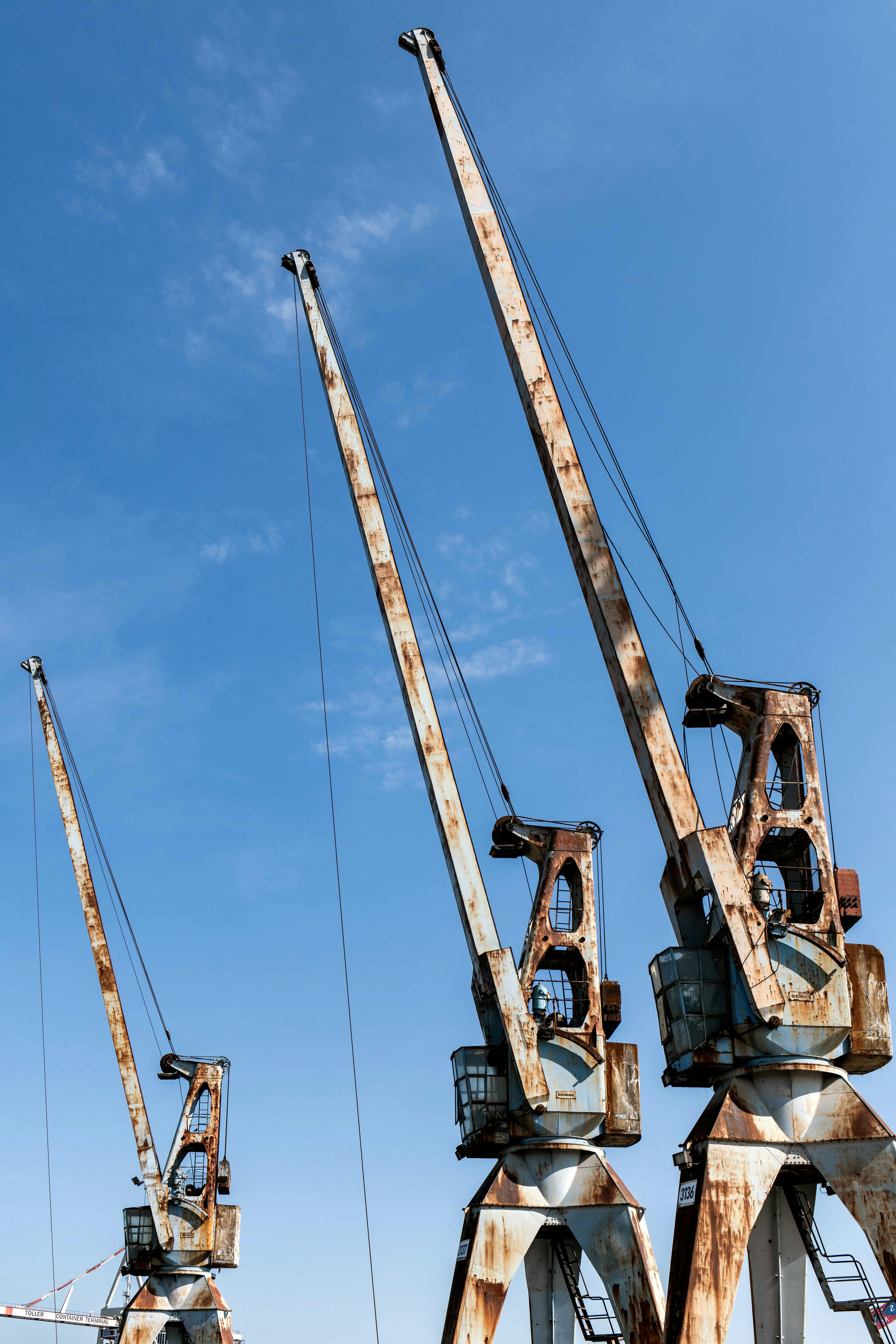 Photo of Rusty Cranes in a Port · Free Stock Photo