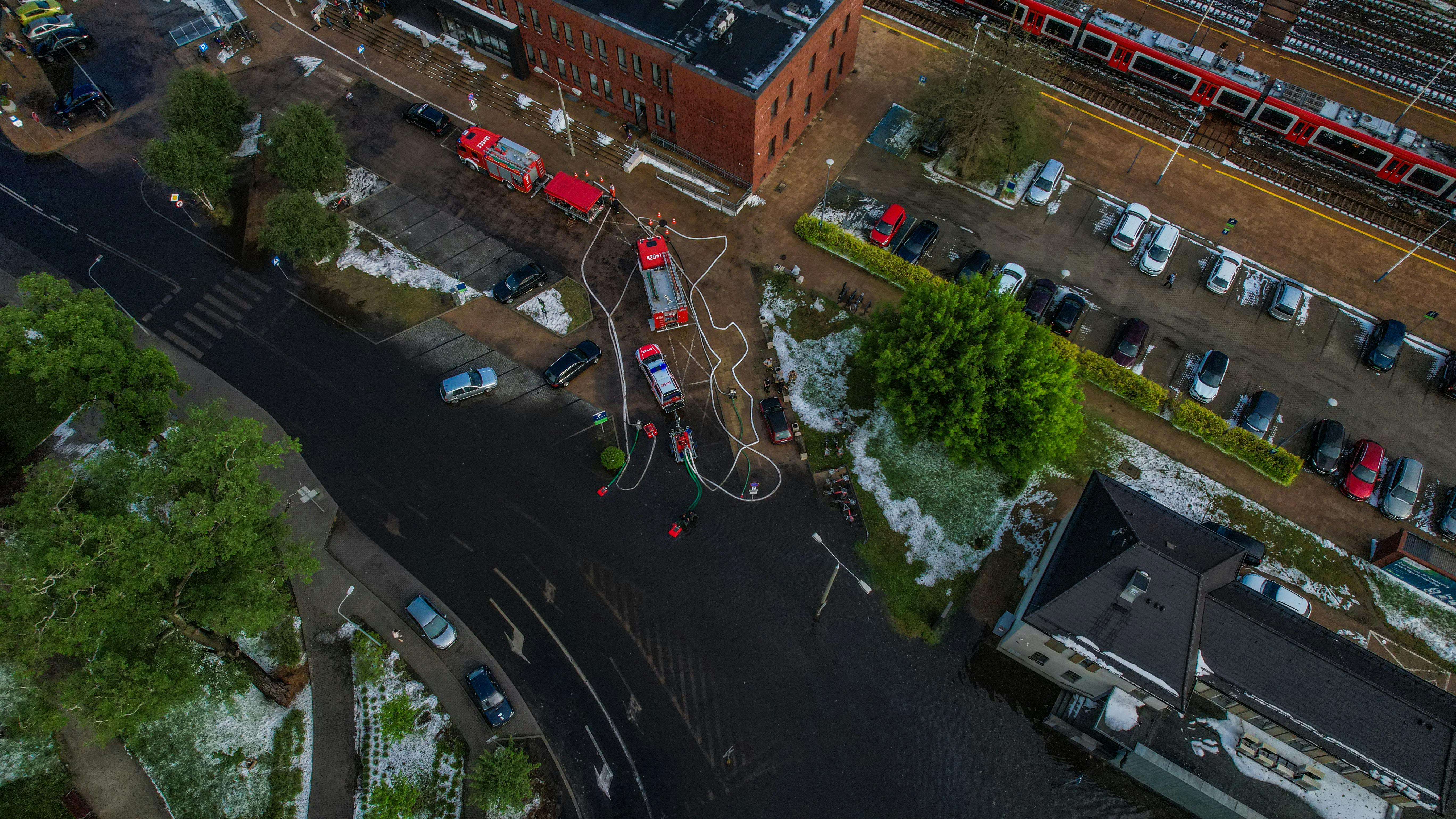 Aerial View of Fire Trucks on a Flooded Street · Free Stock Photo