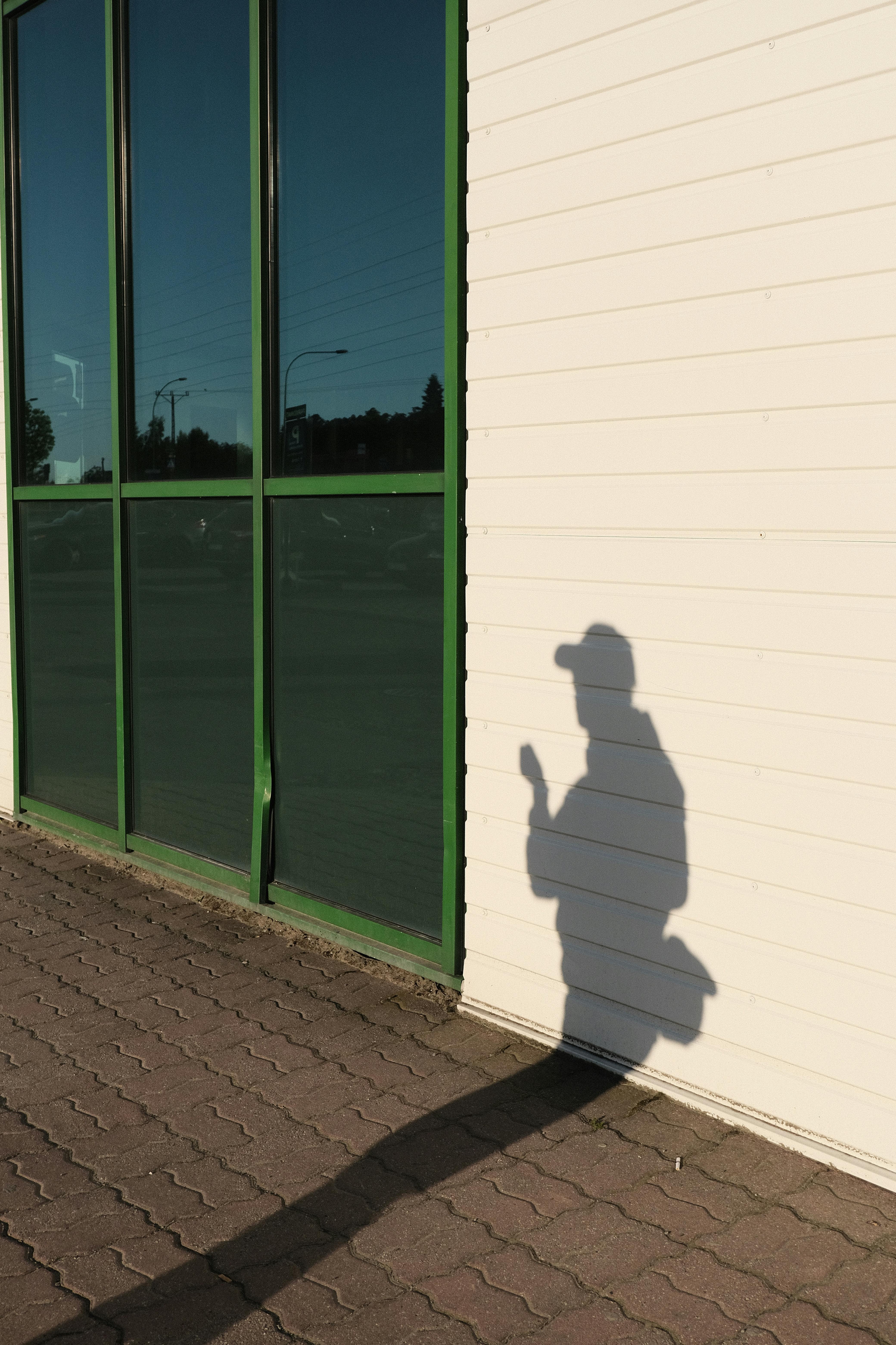 Man Shadow on Building Wall · Free Stock Photo