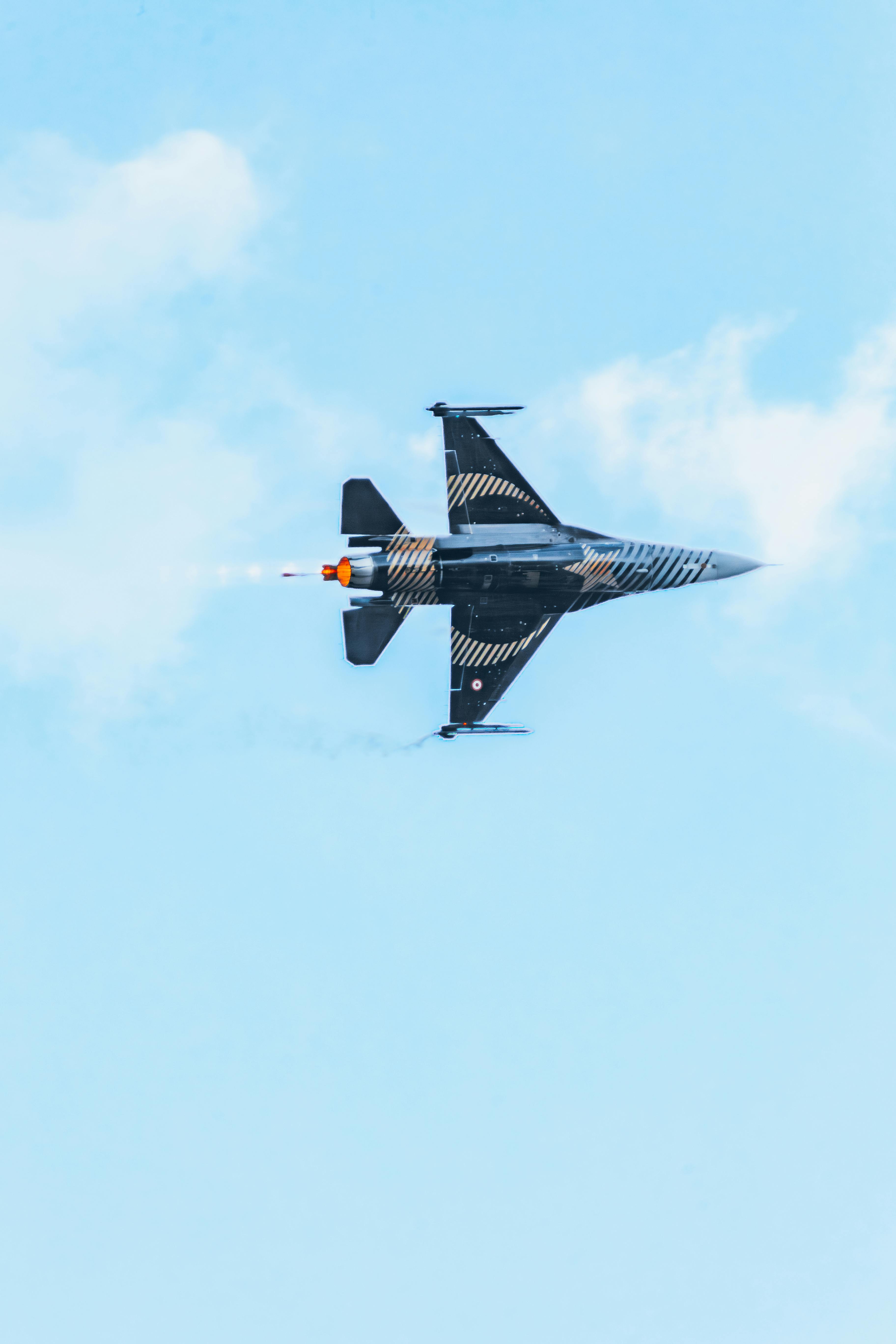 Fighter Jet Flying against the Sky · Free Stock Photo