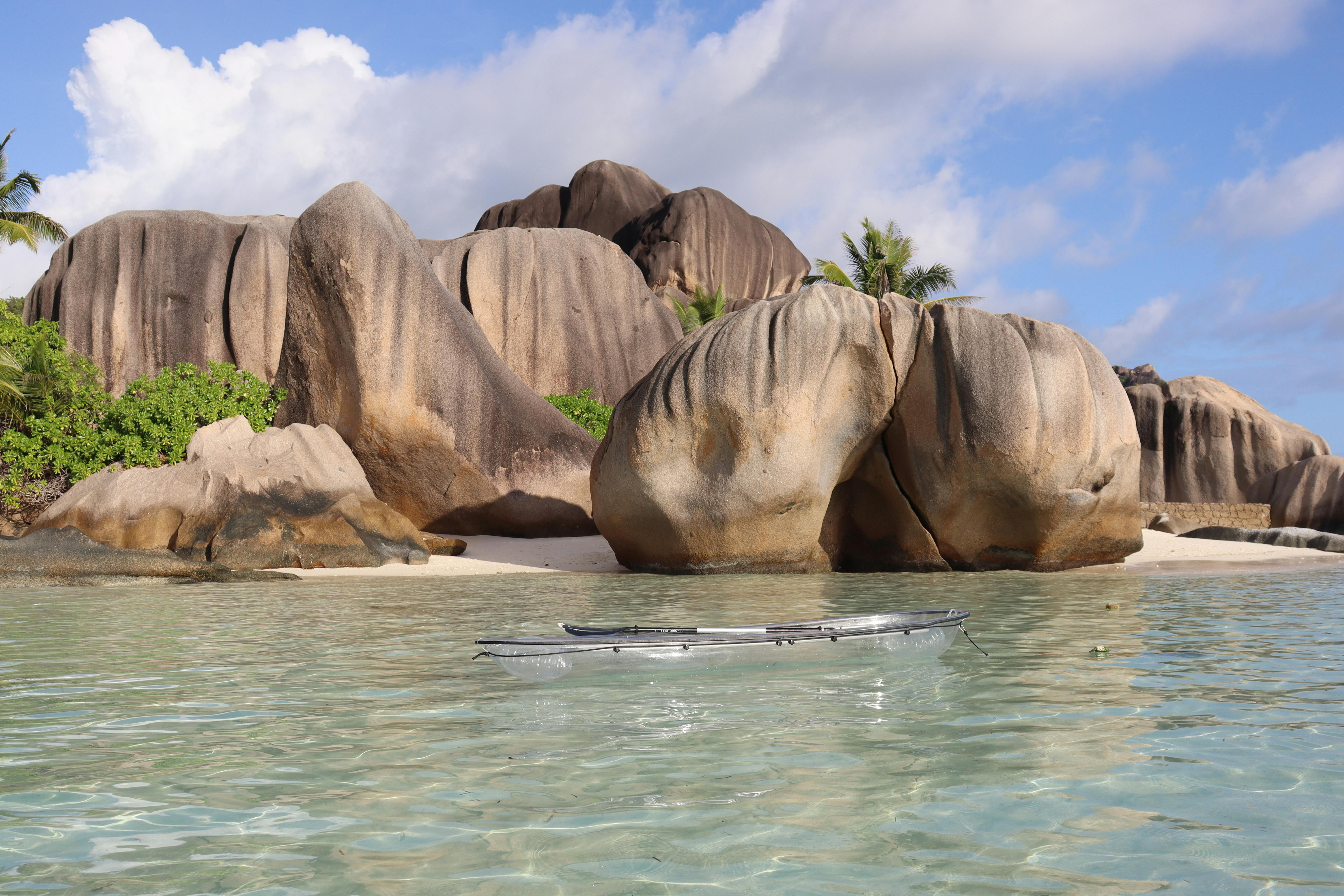 Canoe on Sea near Rocks at Anse Source Argent in Seychelles · Free ...