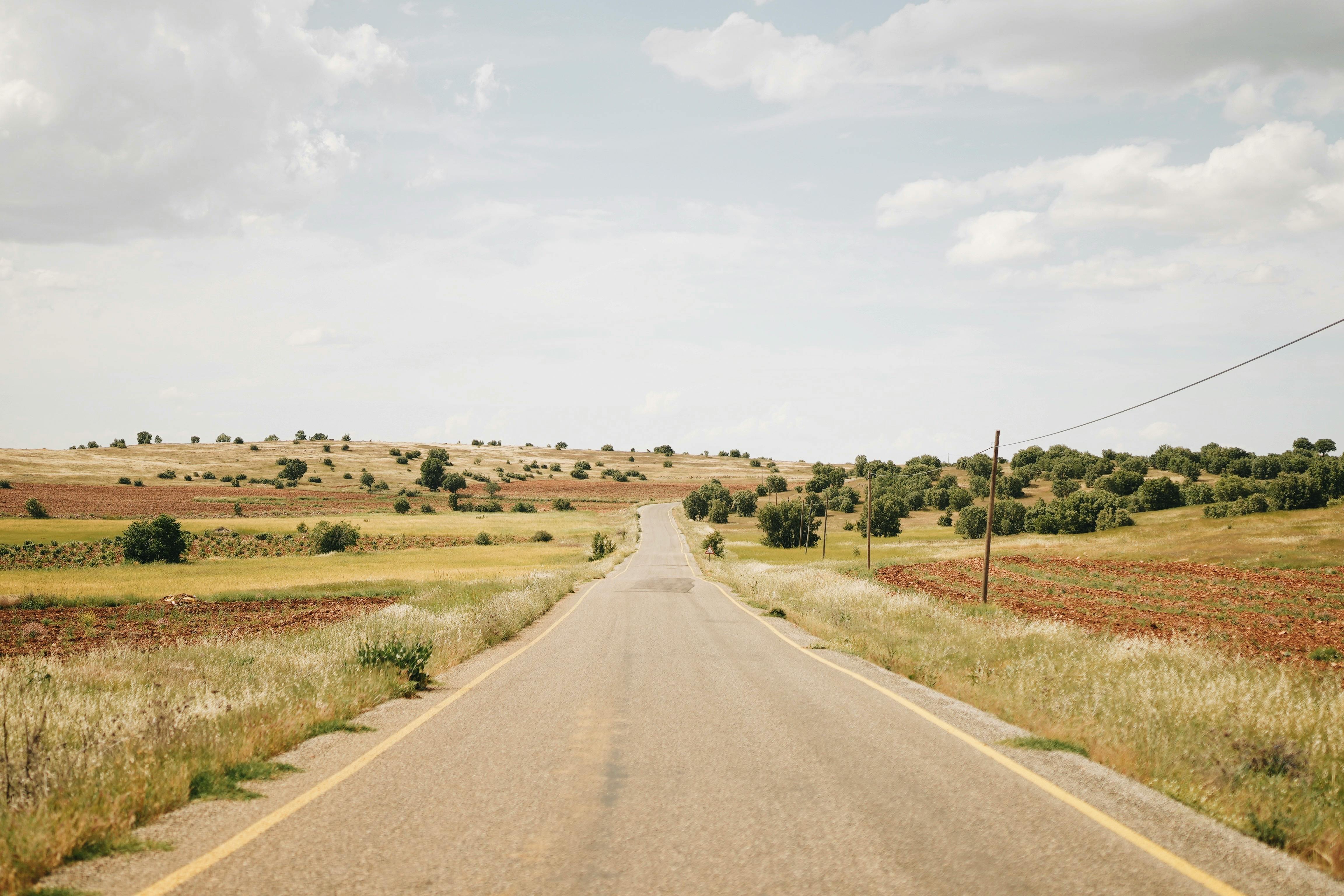 Highway Running through the Fields · Free Stock Photo