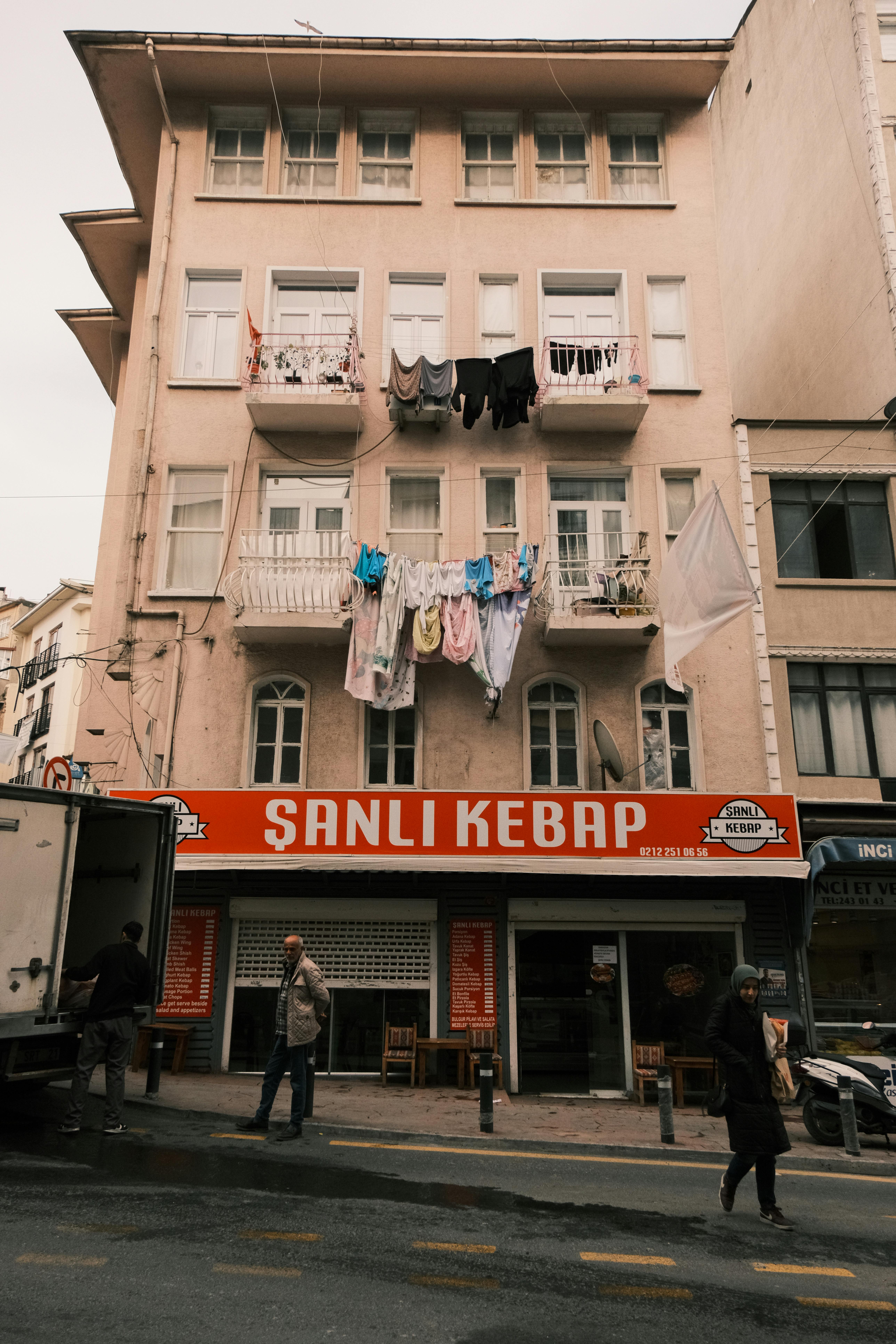 City Building with Kebab Restaurant on the Ground Floor · Free Stock Photo