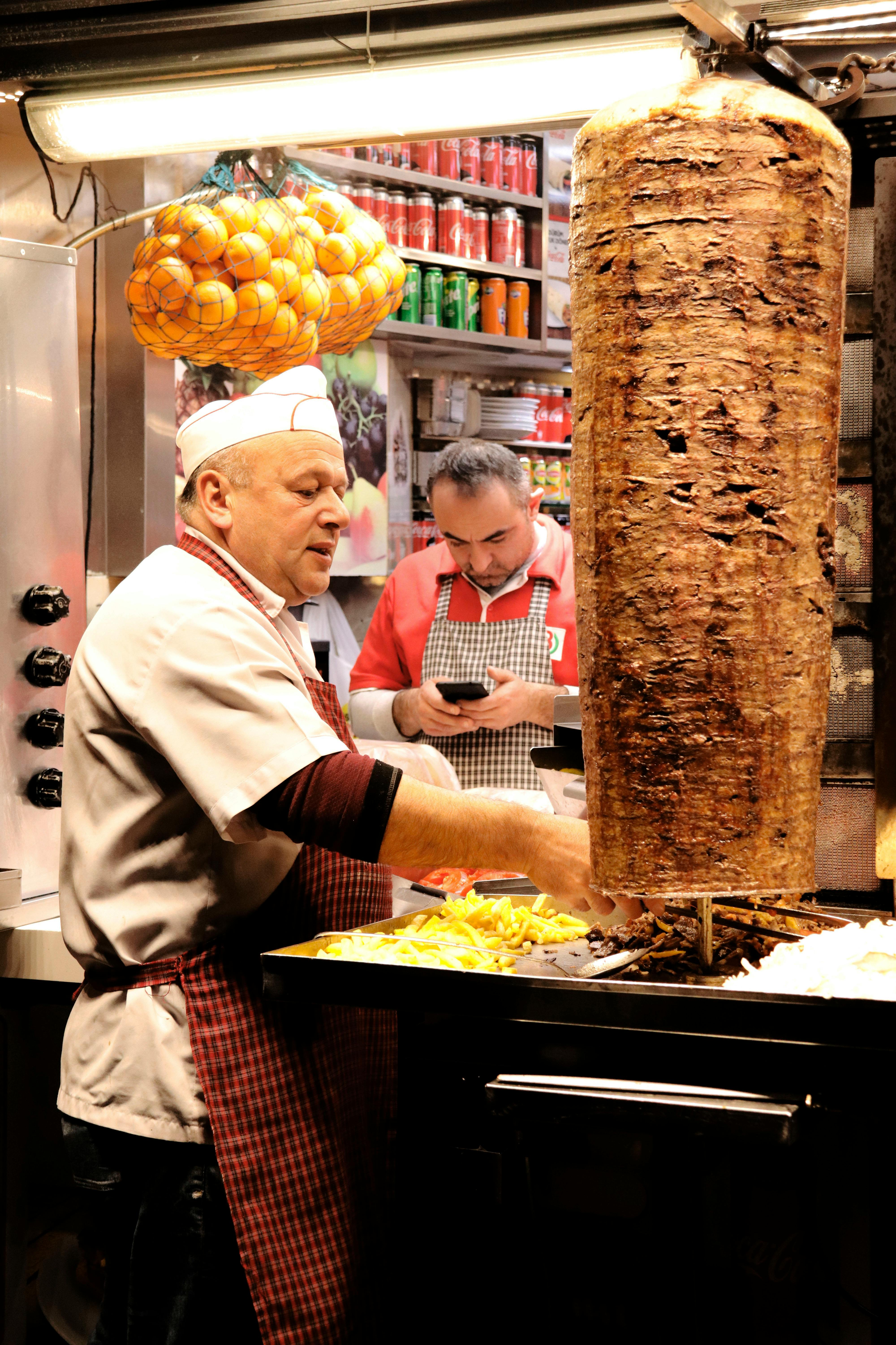 Men Preparing Food in a Kebab Restaurant · Free Stock Photo