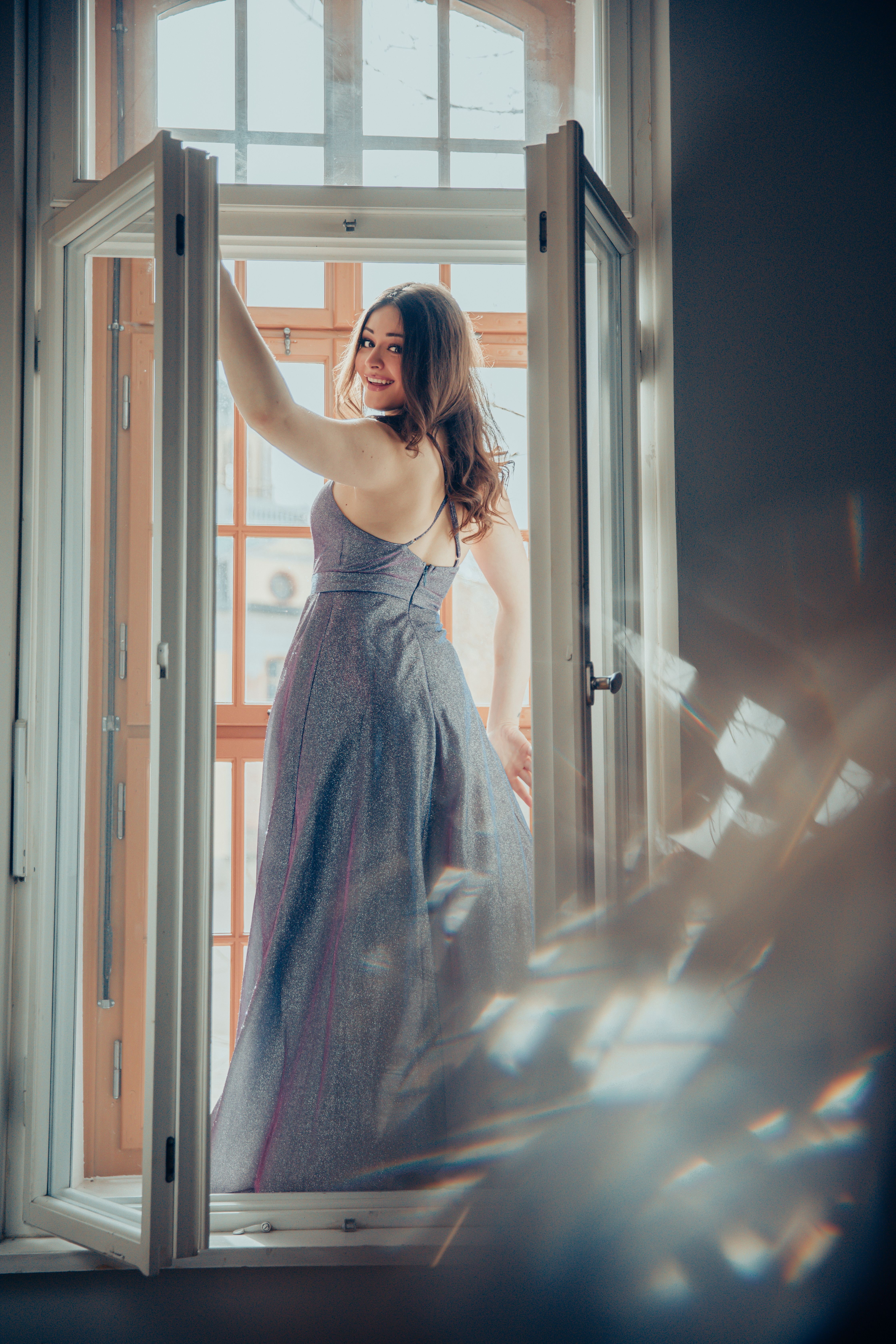 Beautiful Woman Standing on a Window Sill · Free Stock Photo