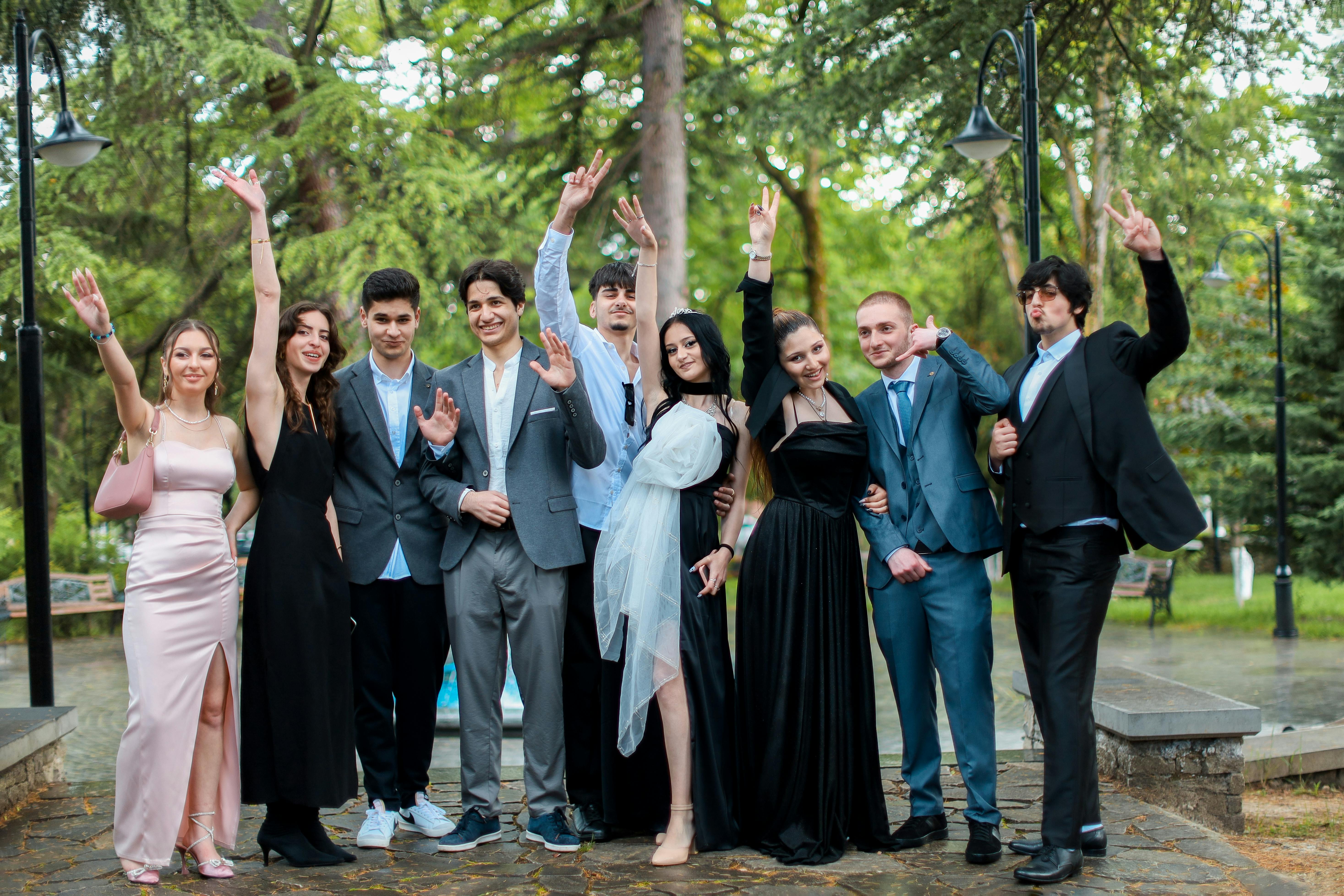 A group of people posing for a photo in formal attire · Free Stock Photo
