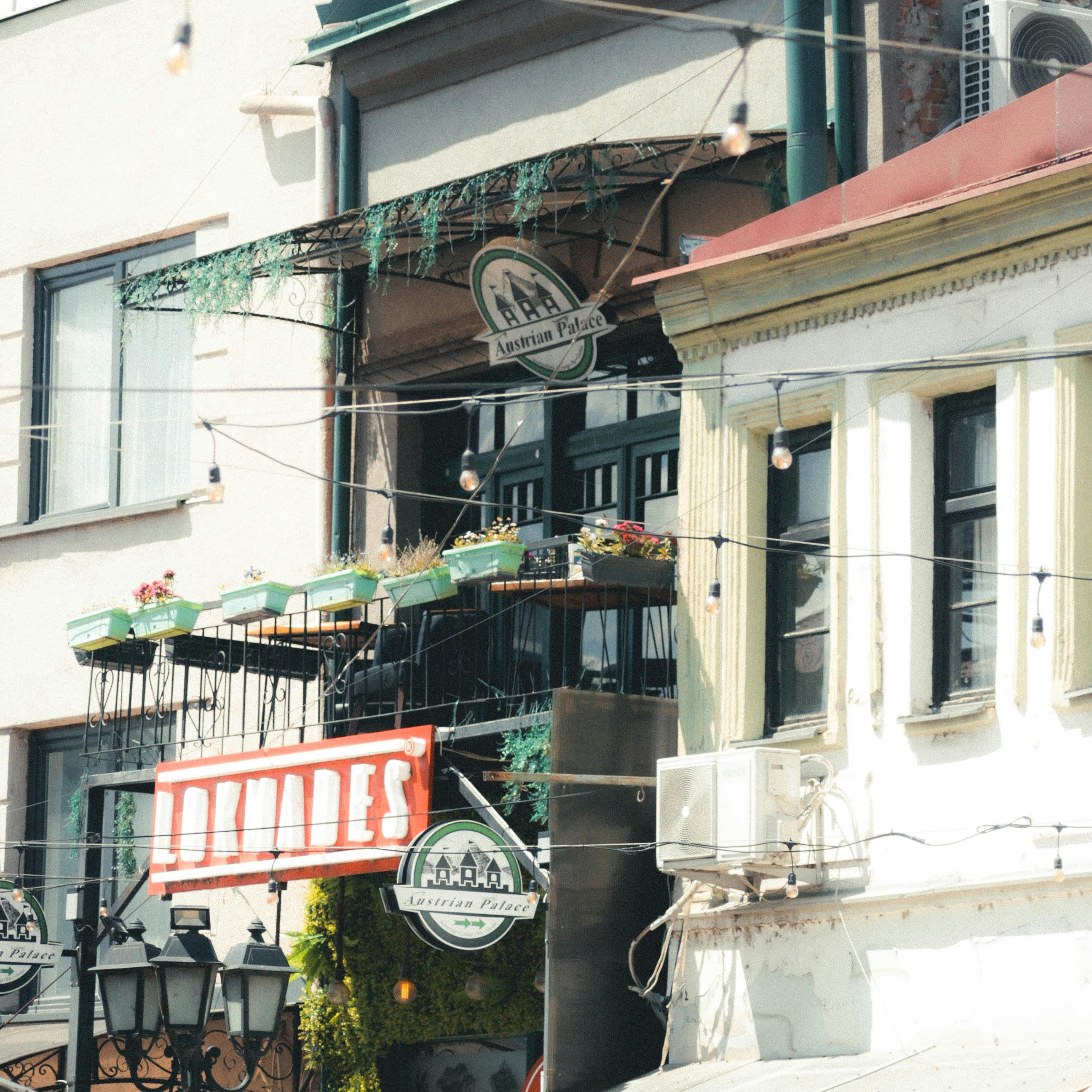 Narrow Bar Cafe between other Buildings with Exposed Wires around ...
