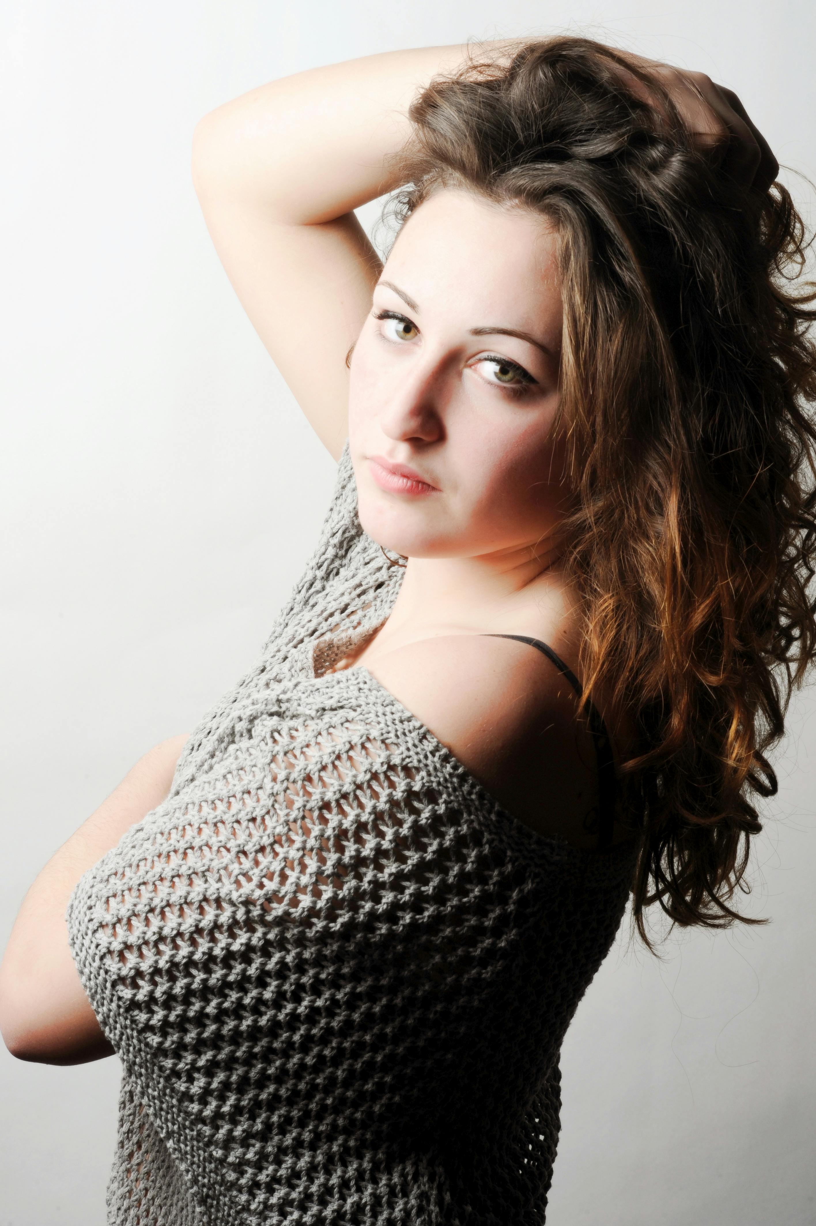 Portrait of Woman Fixing Hair · Free Stock Photo