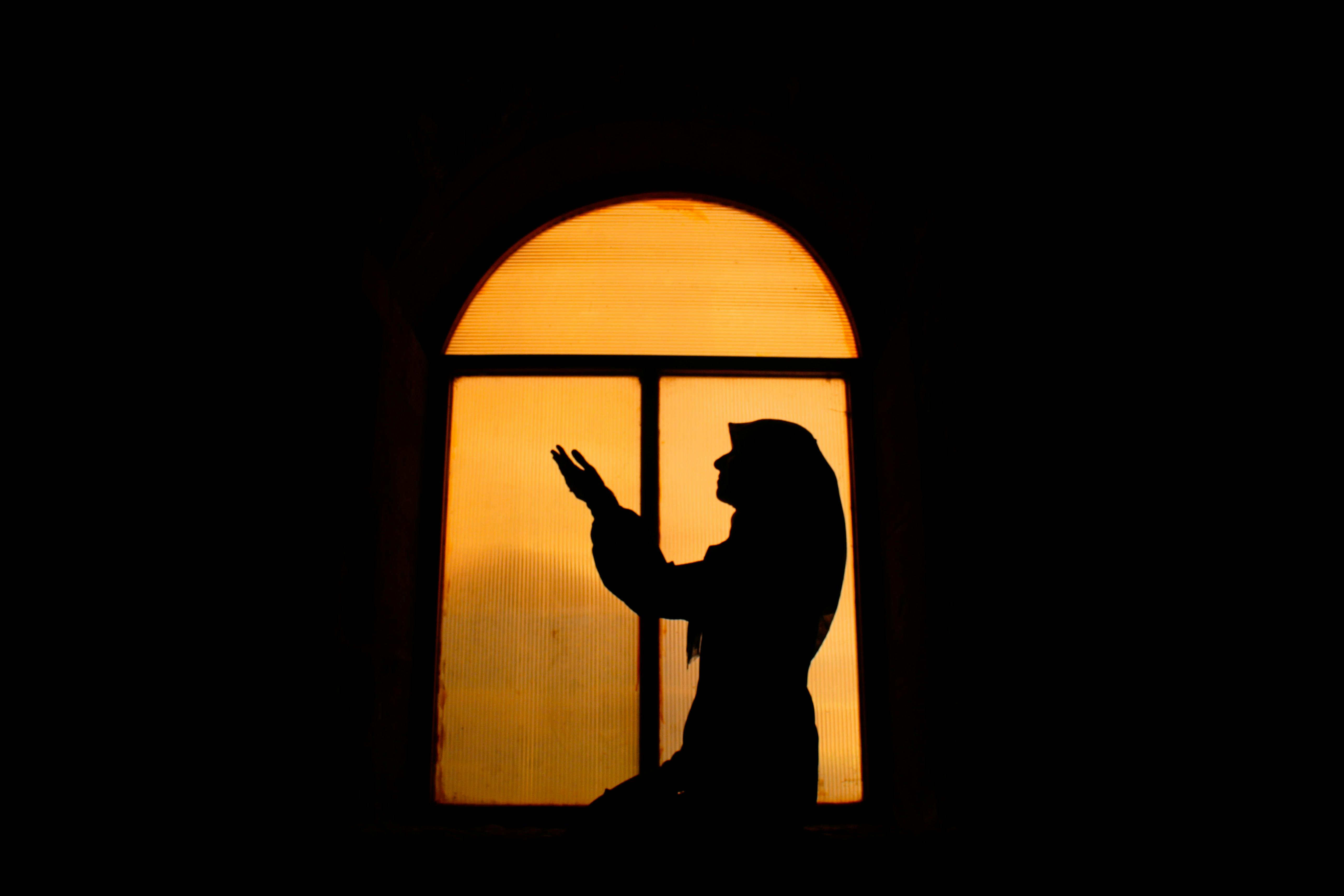 Silhouette of Person Near Window · Free Stock Photo