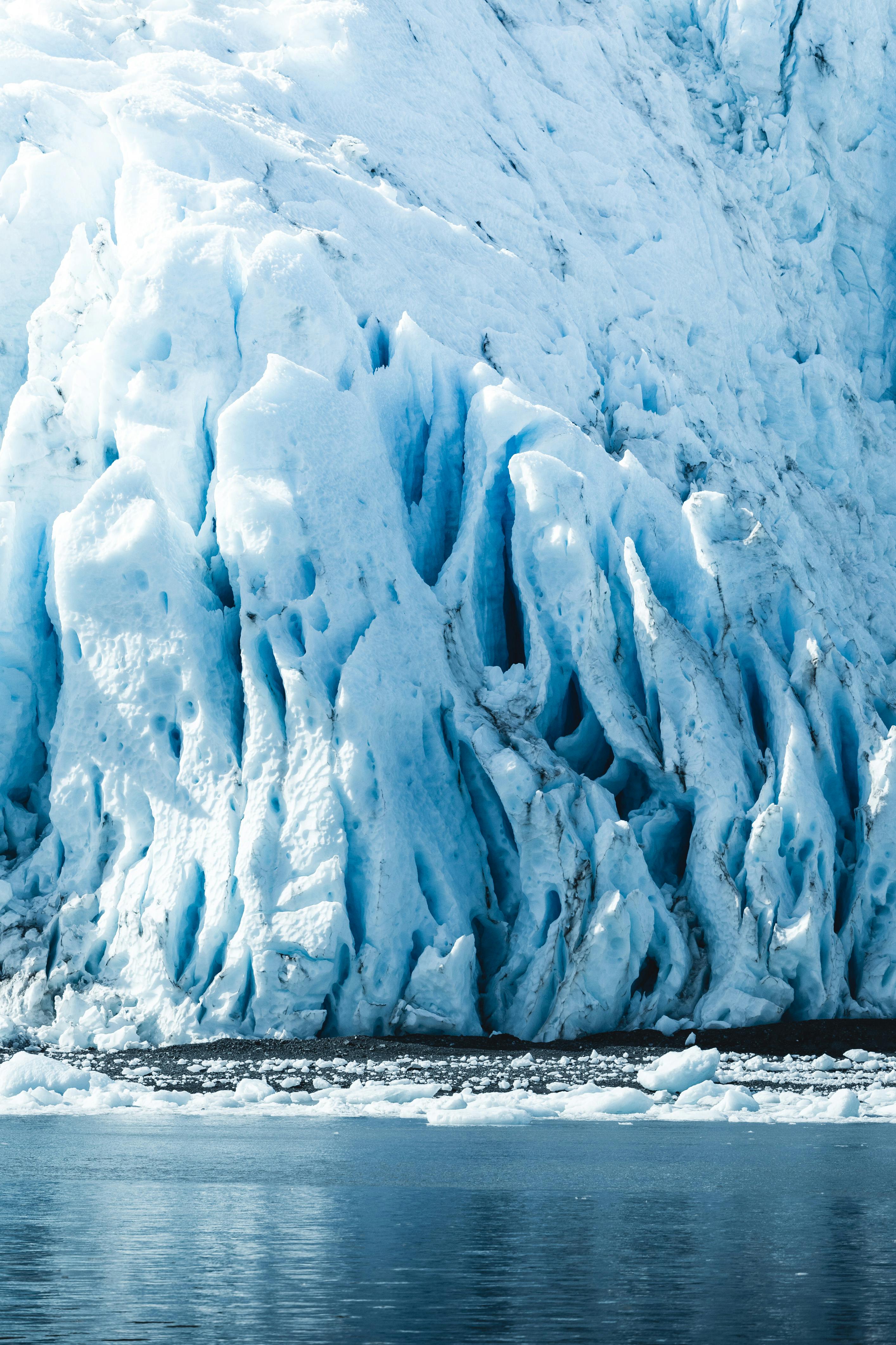 Iceberg and Ice on Sea Shore · Free Stock Photo