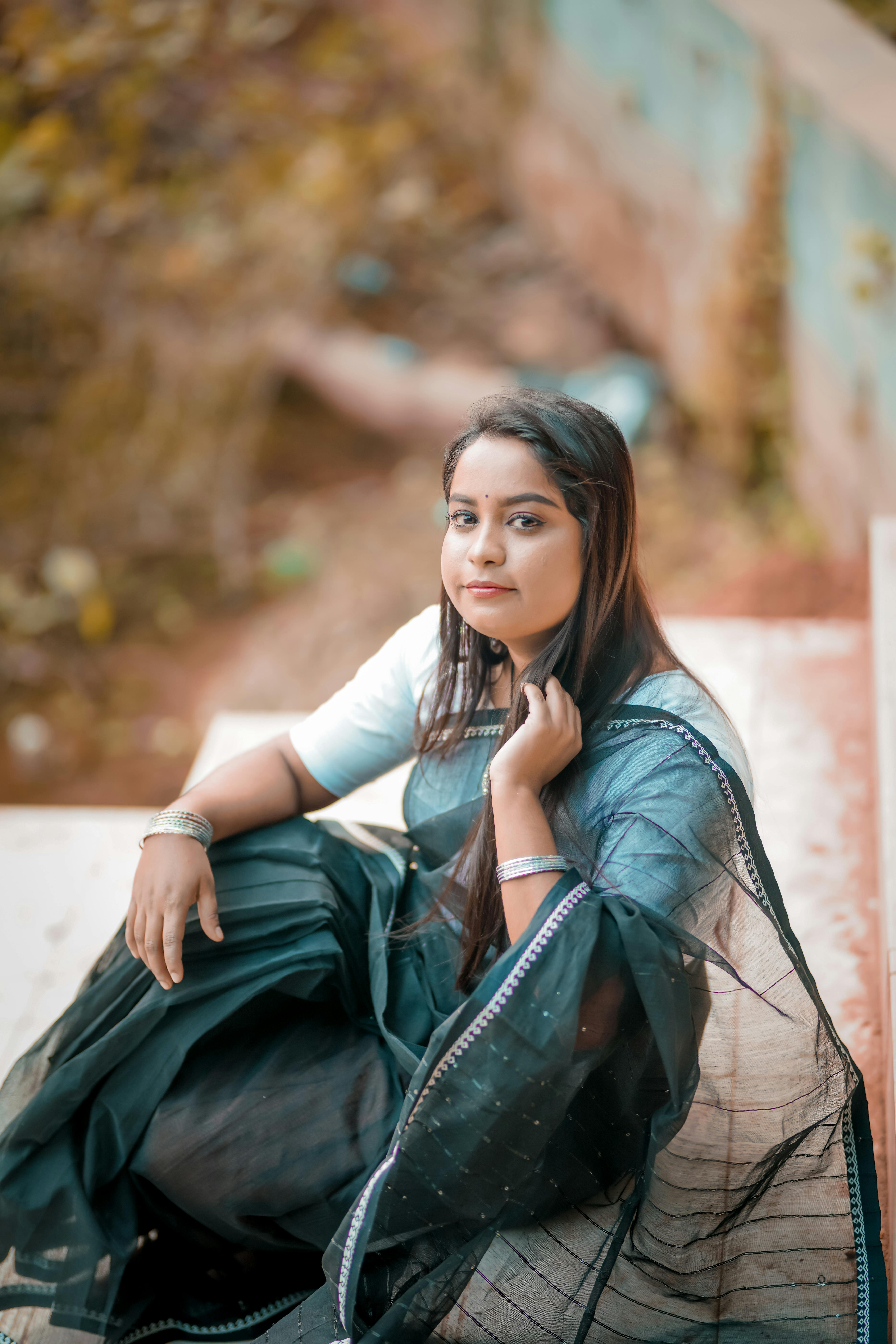 Woman Sitting in Park Wearing Traditional Transparent Sari Dress on ...