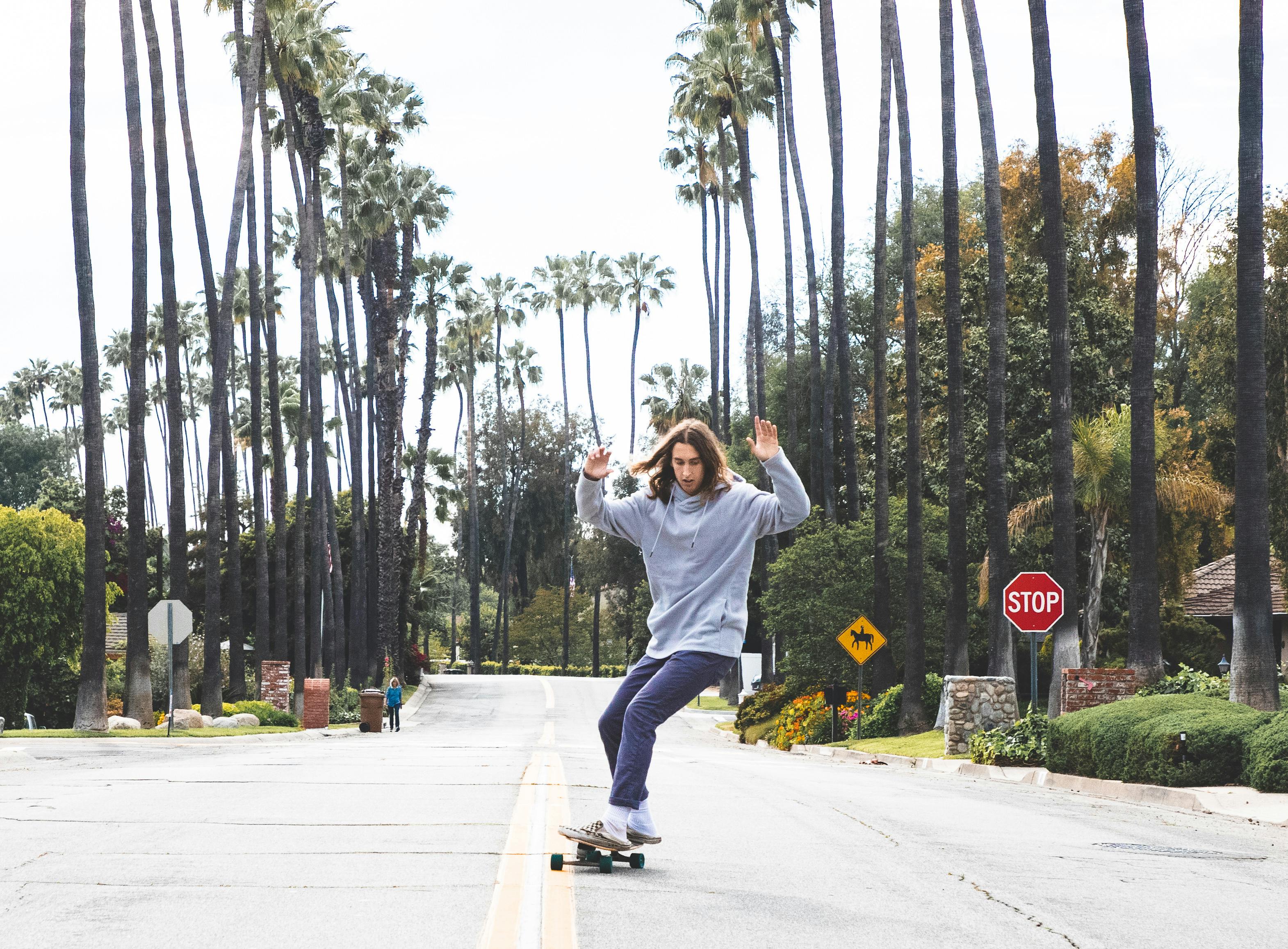 Man Riding A Longboard · Free Stock Photo