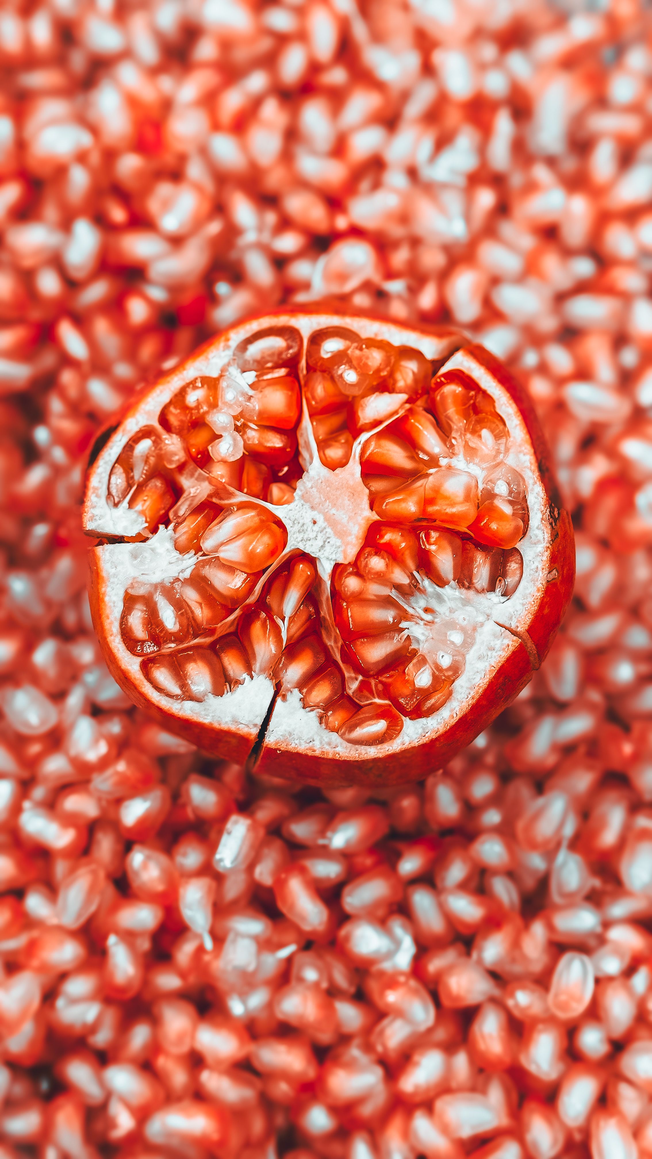 Open Pomegranate on its Grains · Free Stock Photo
