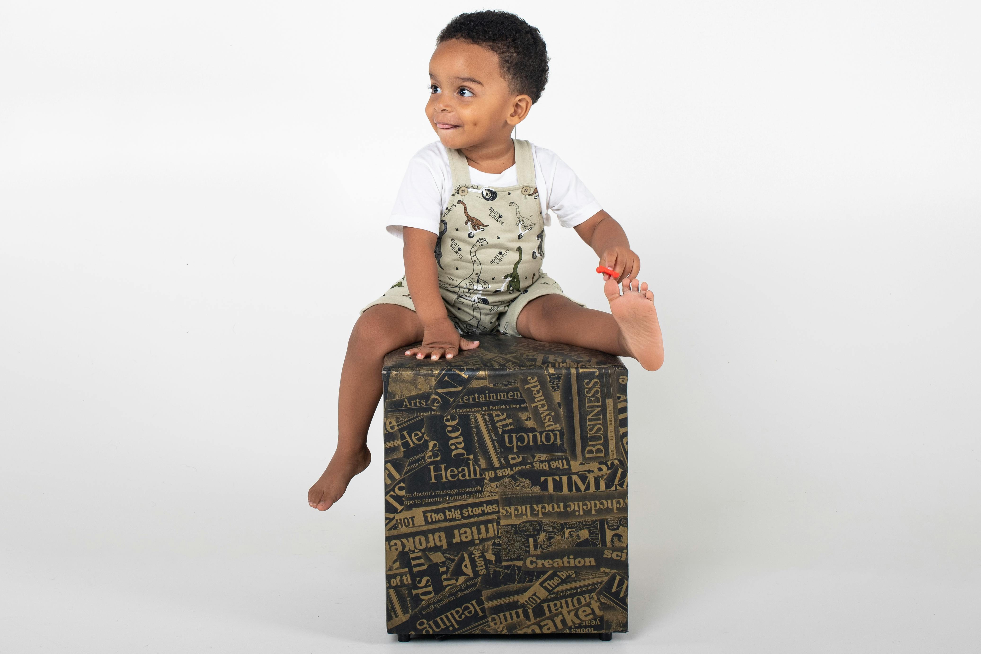 Boy Sitting on Box · Free Stock Photo