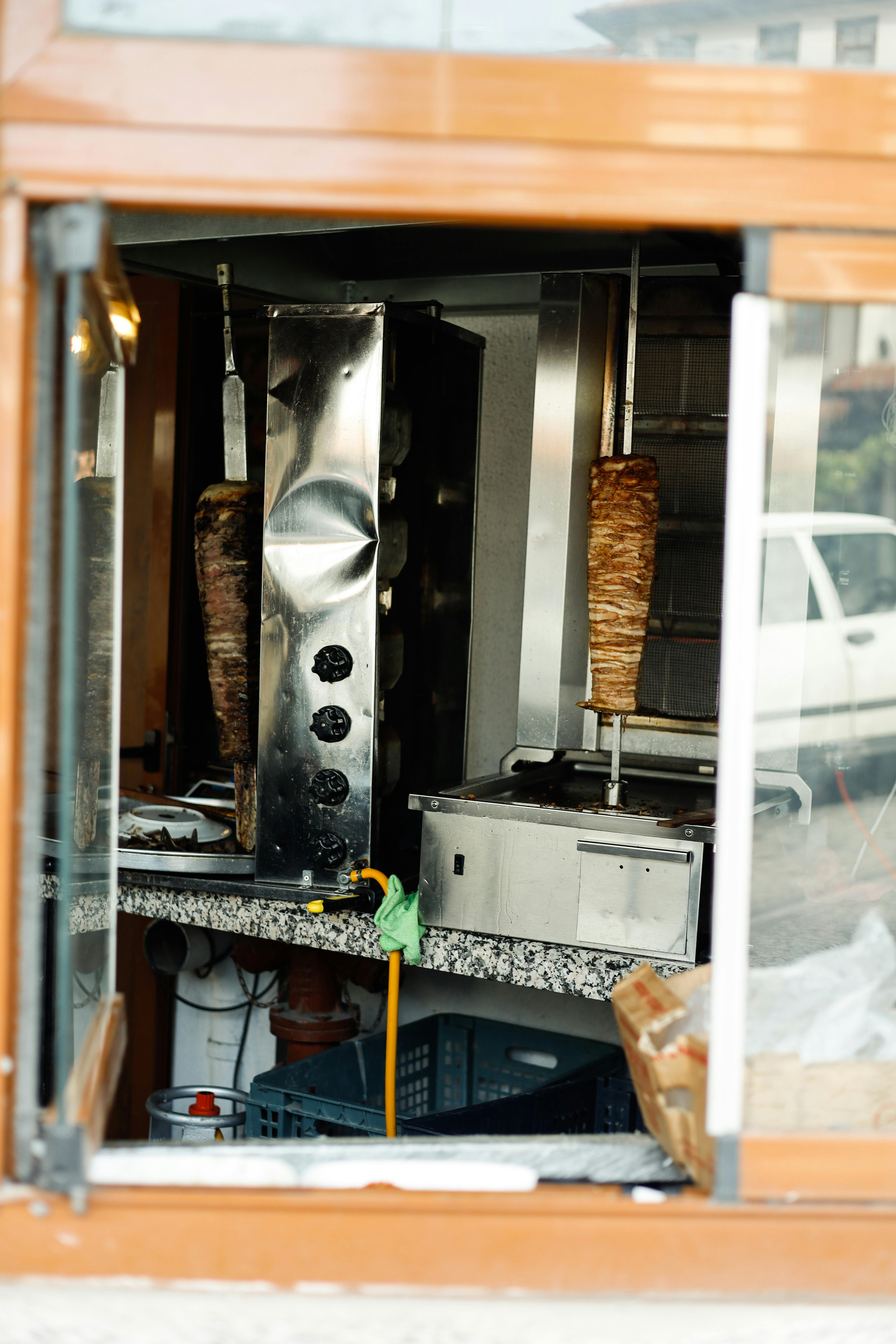 Meat and Hands of Man Preparing Doner · Free Stock Photo