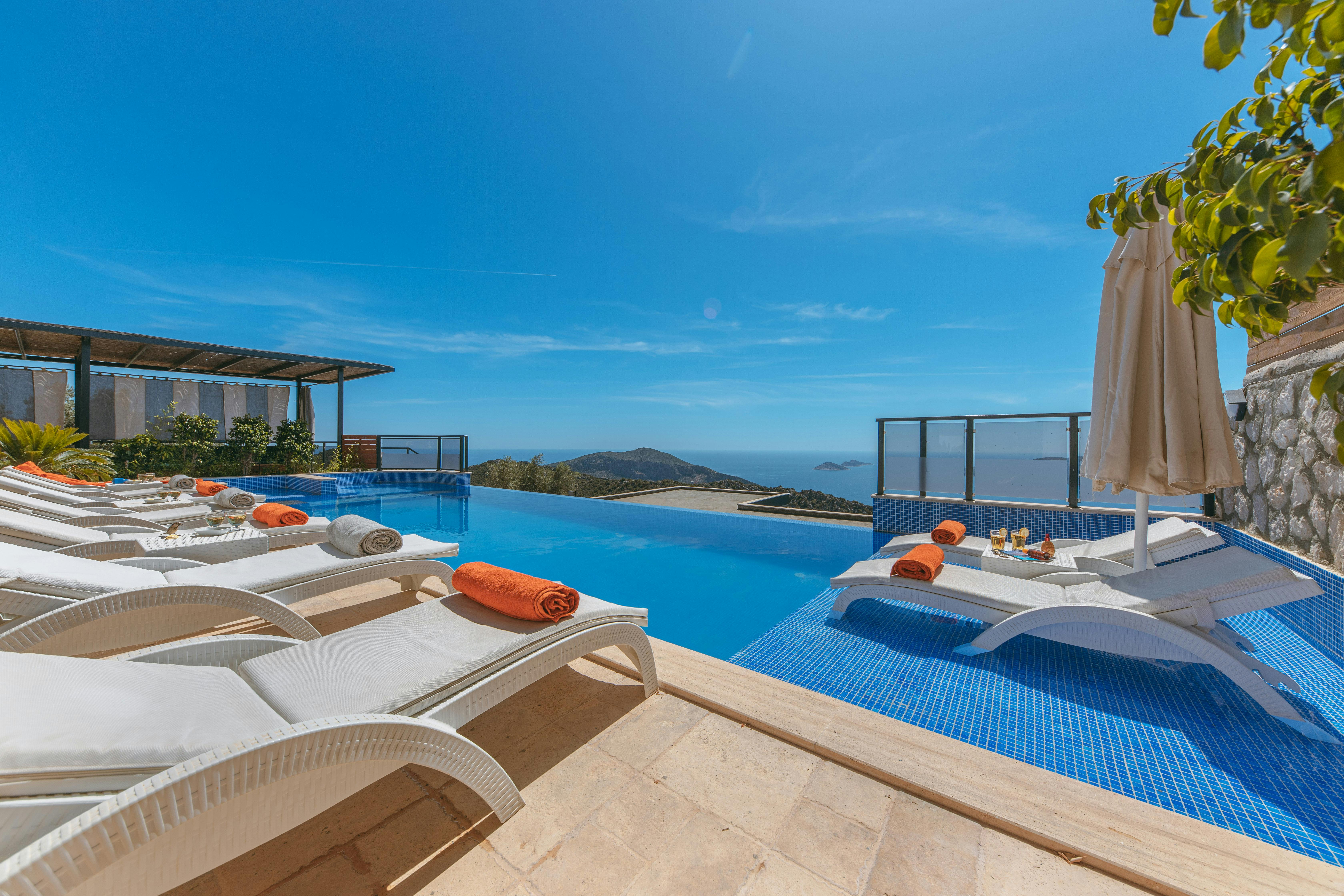 Sunbeds around Pool in Summer Resort · Free Stock Photo