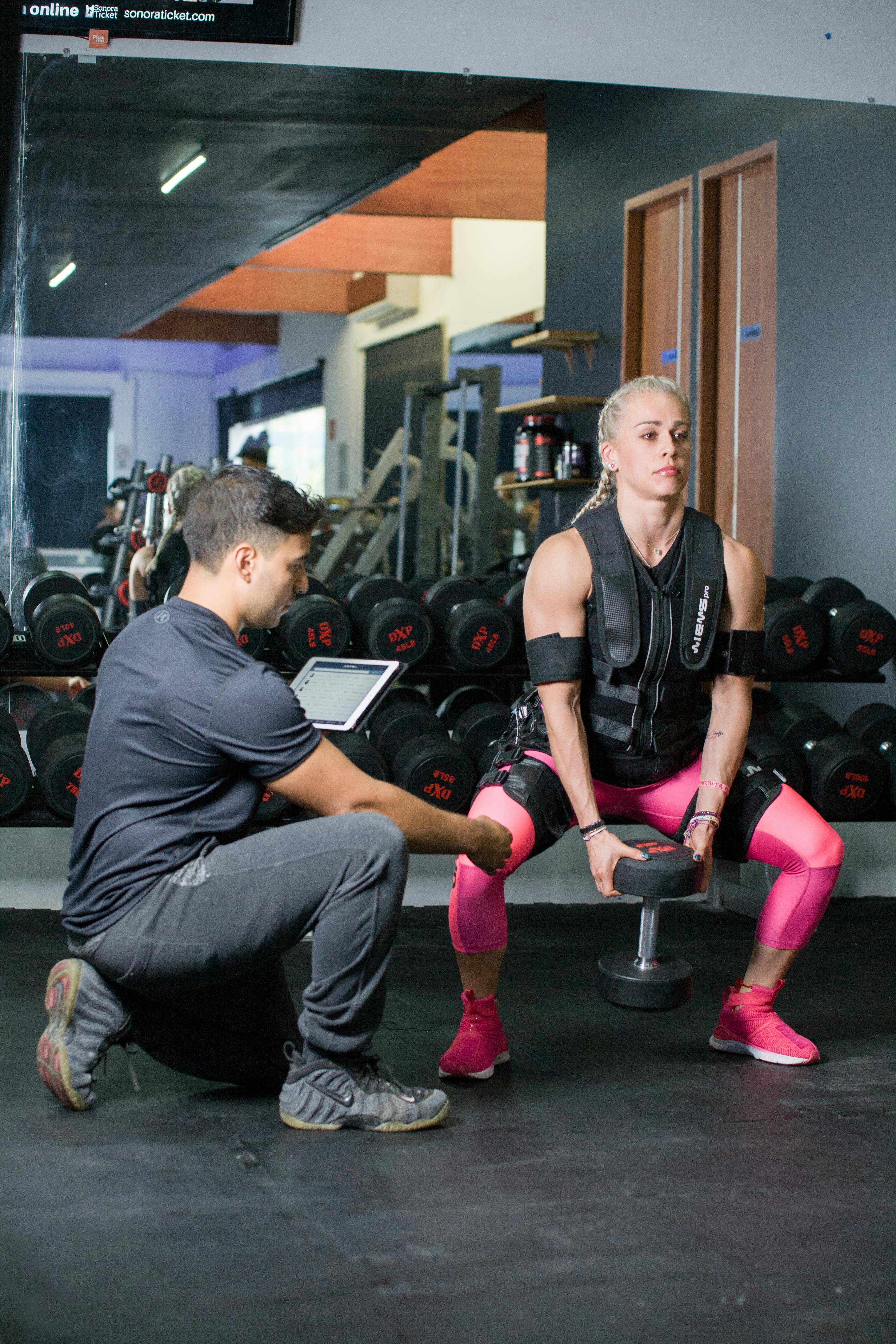 Woman Exercising at the Gym · Free Stock Photo