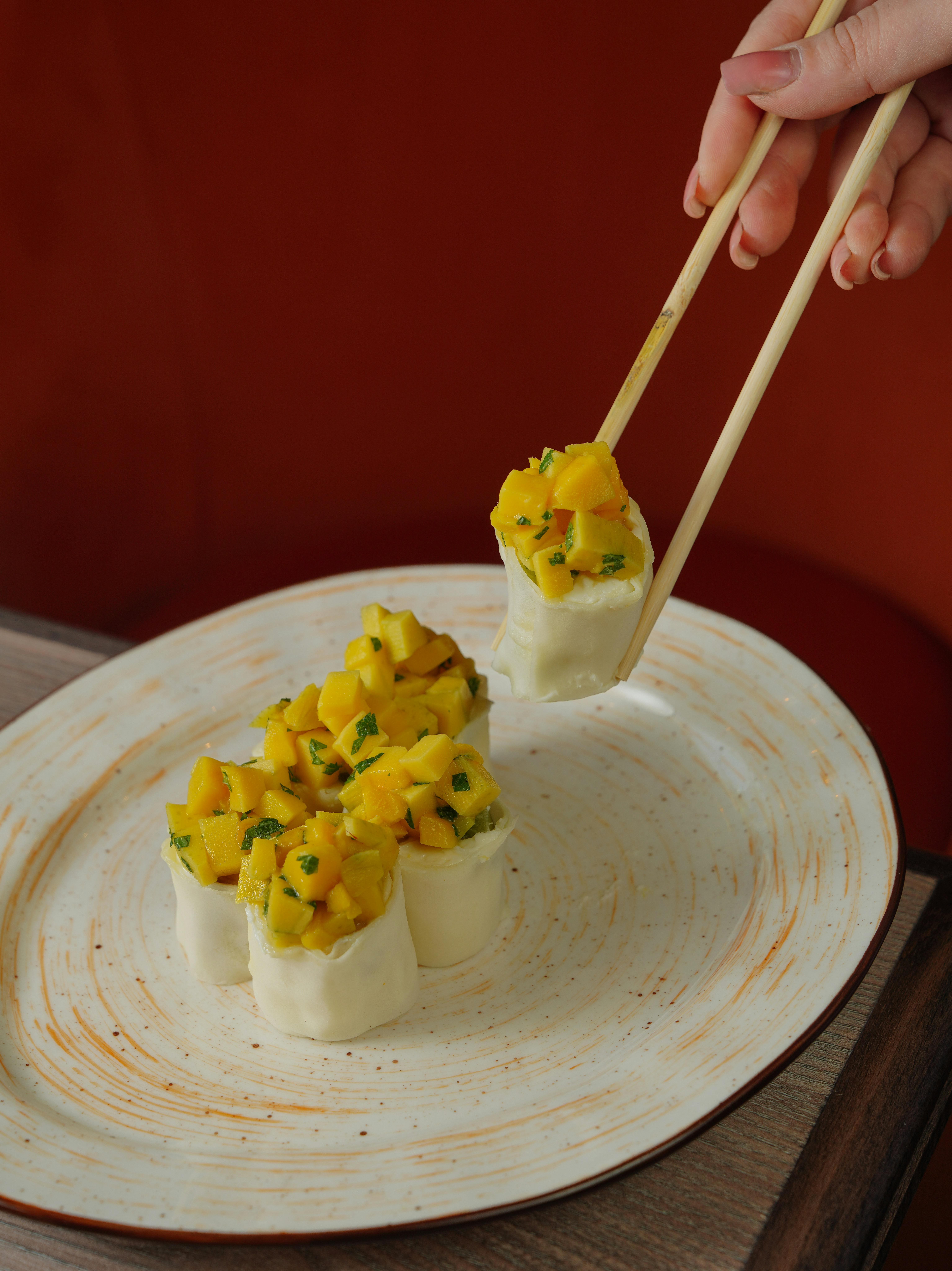 Close-up of a Person Grabbing a Piece of Dessert with Chopsticks · Free ...