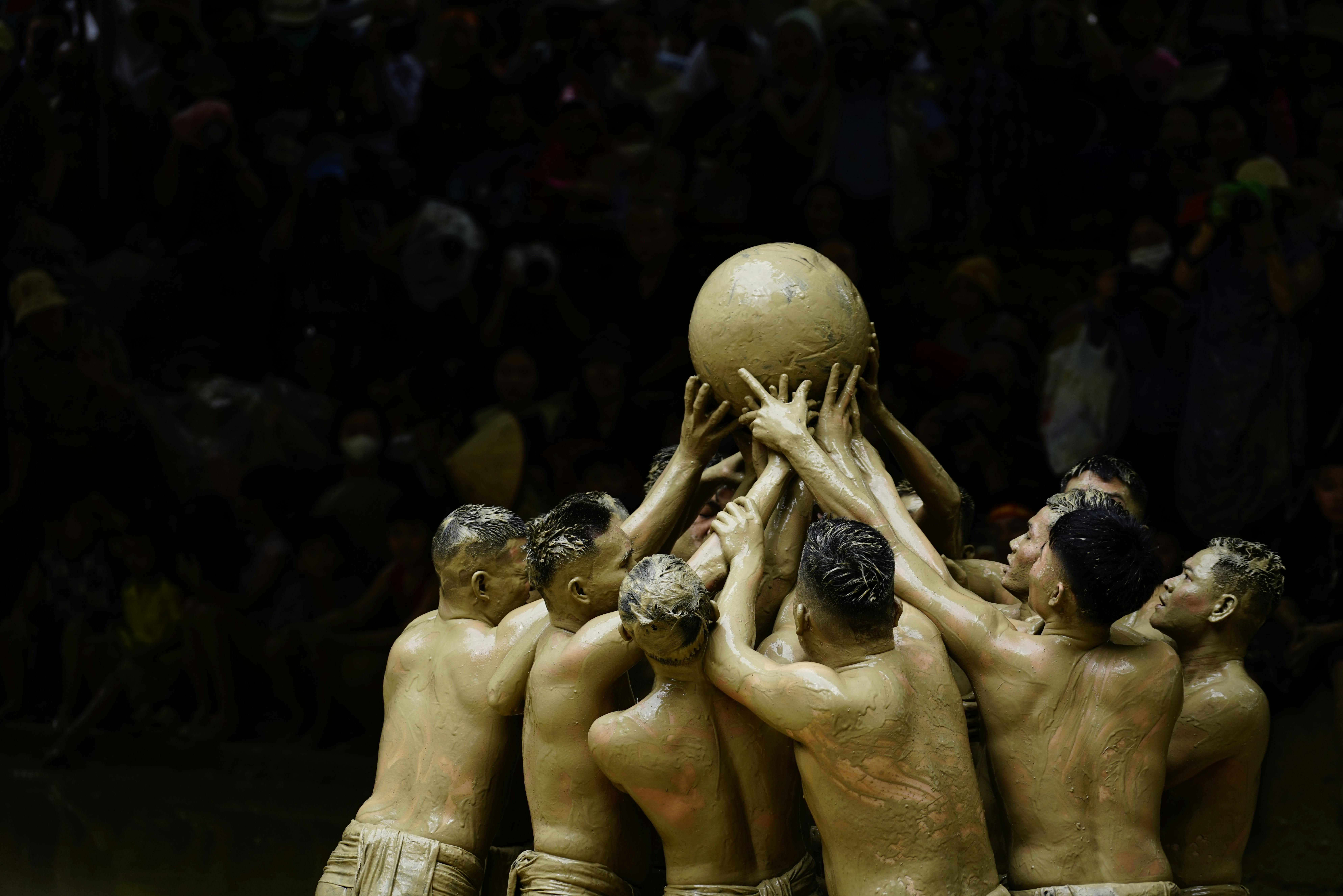 Men in Mud Playing Ball in Traditional Festival · Free Stock Photo