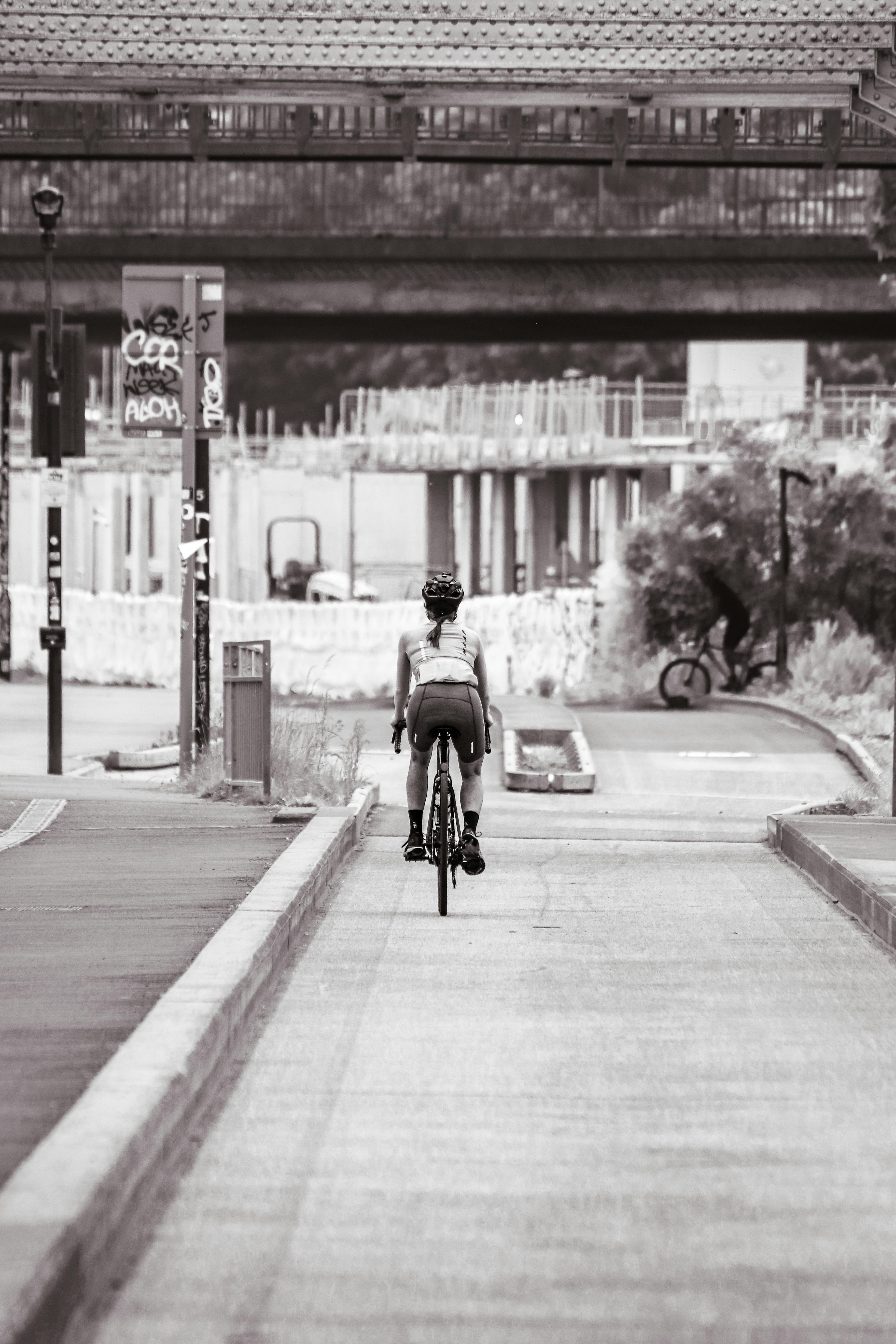 Woman Riding Road Bike on Sidewalk · Free Stock Photo