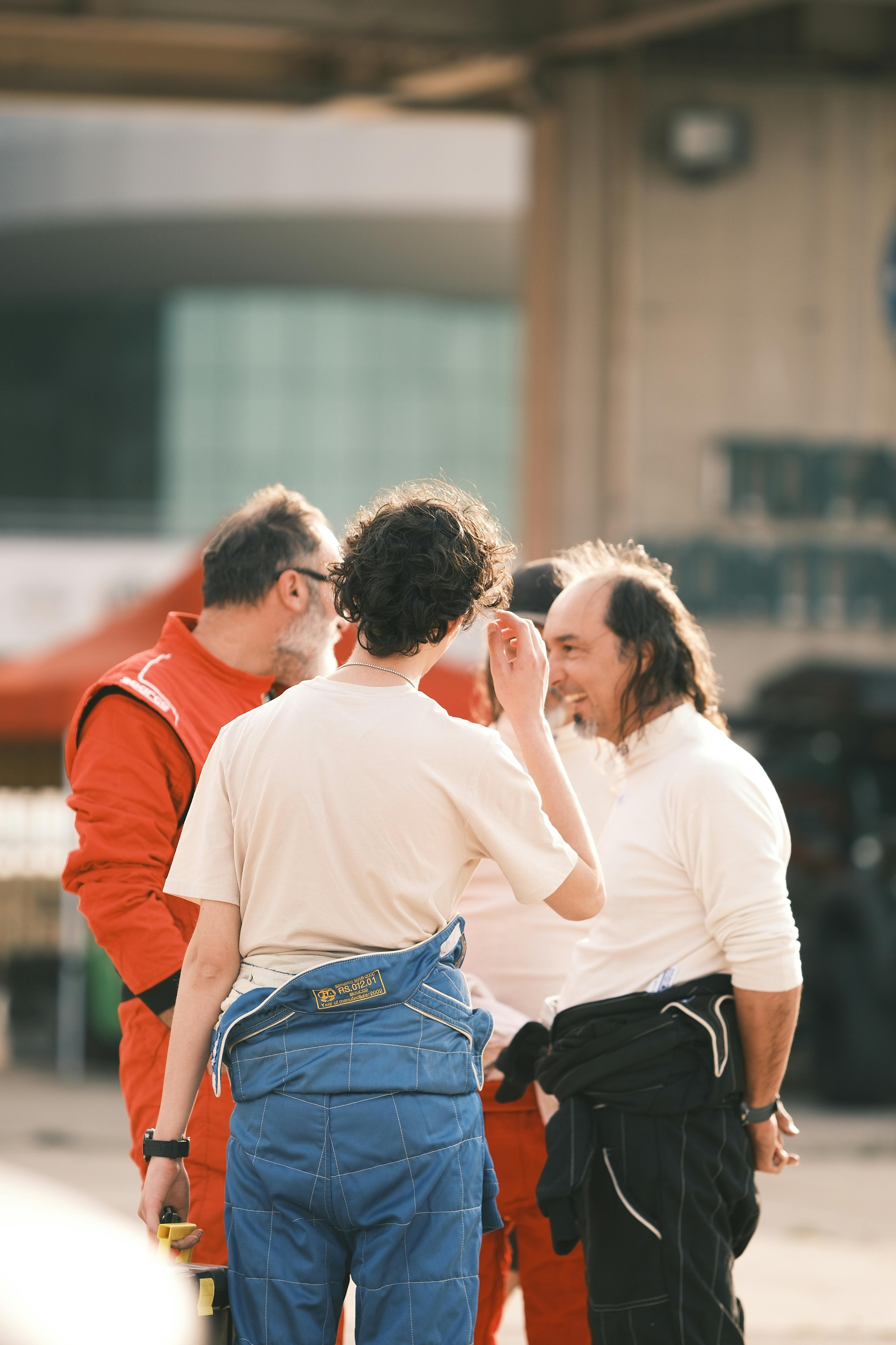 Group of Men Talking Outside · Free Stock Photo
