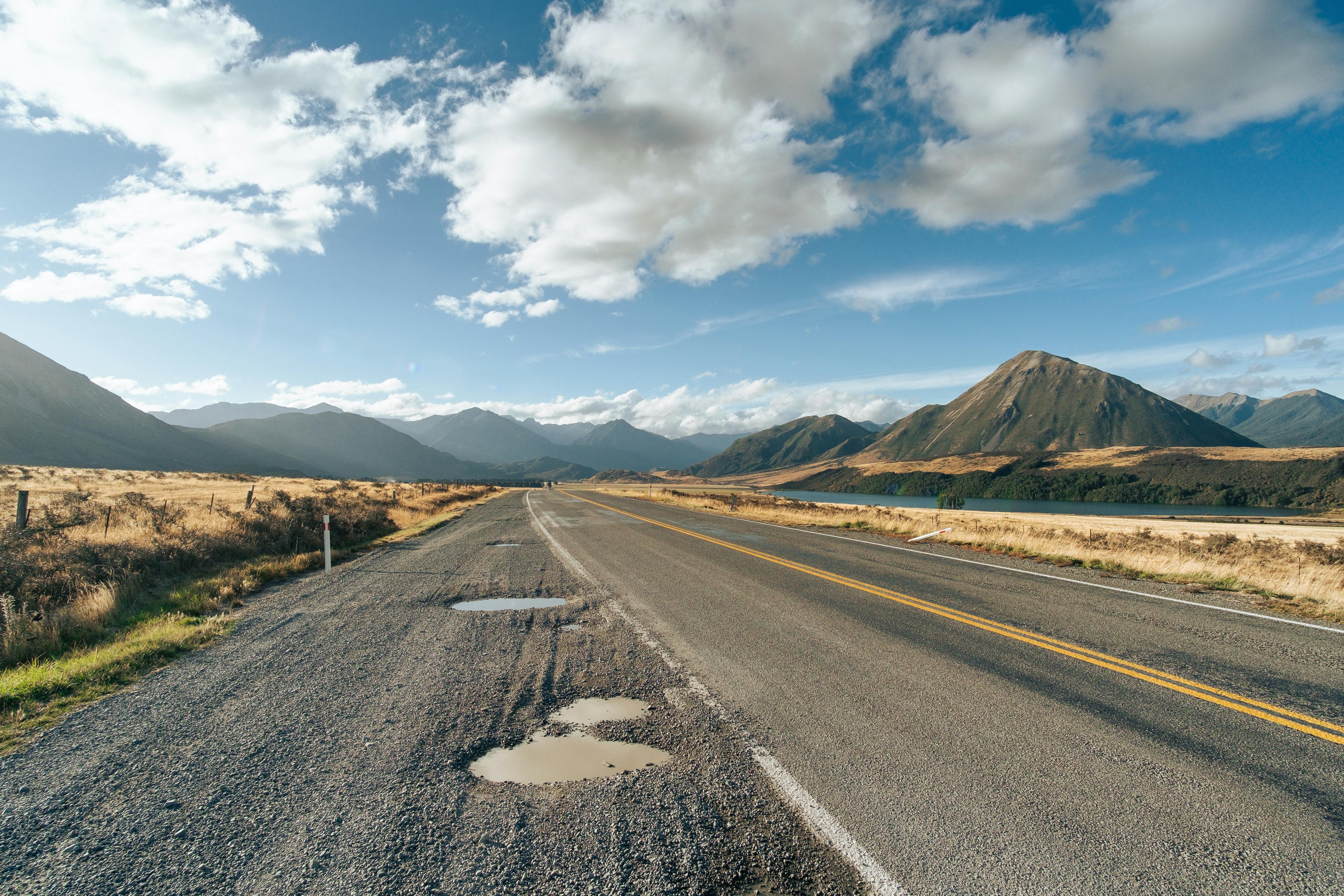 Asphalt Road Among the Steep Mountains · Free Stock Photo