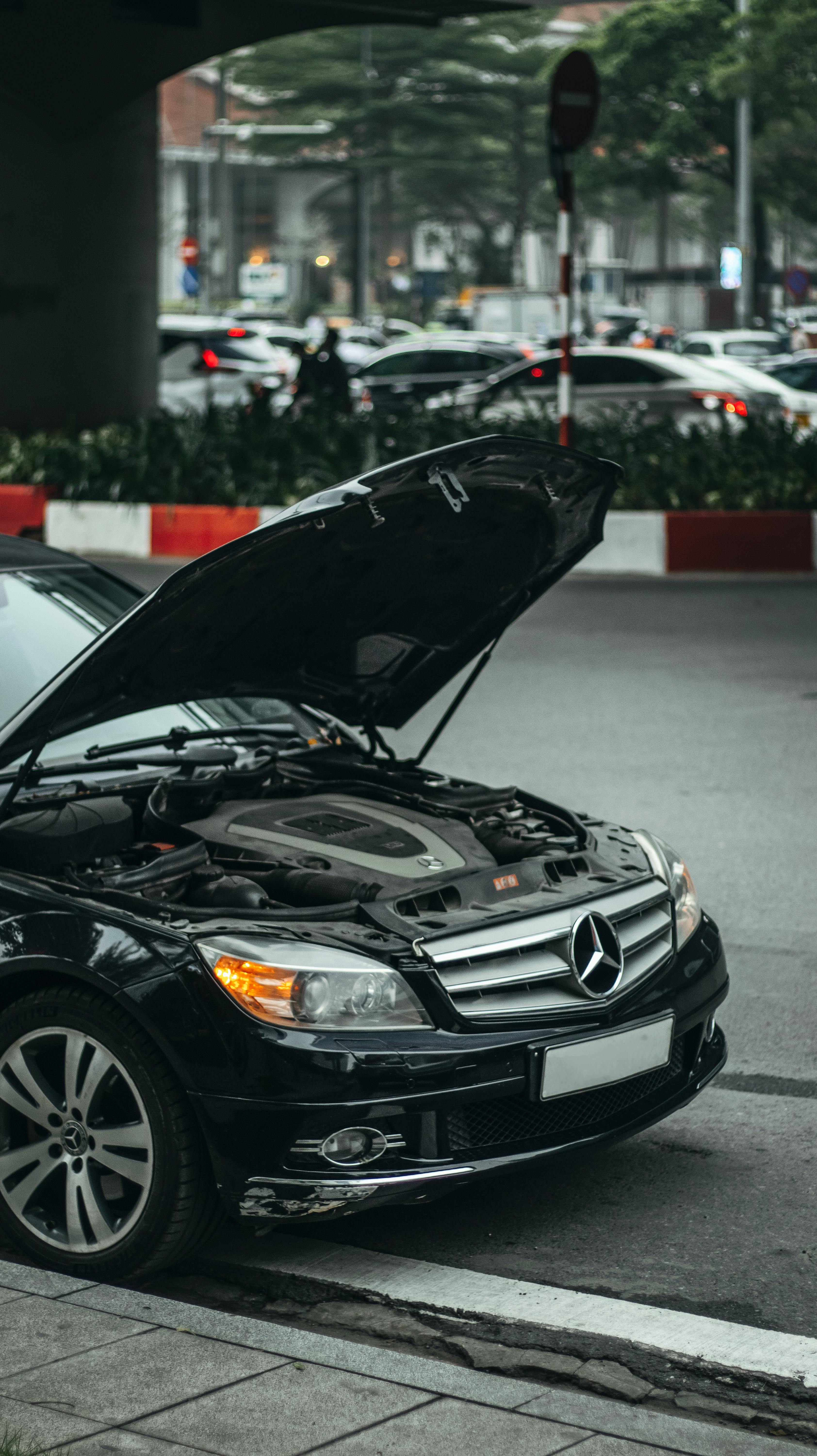 Open Front Hood of a Black Mercedes · Free Stock Photo