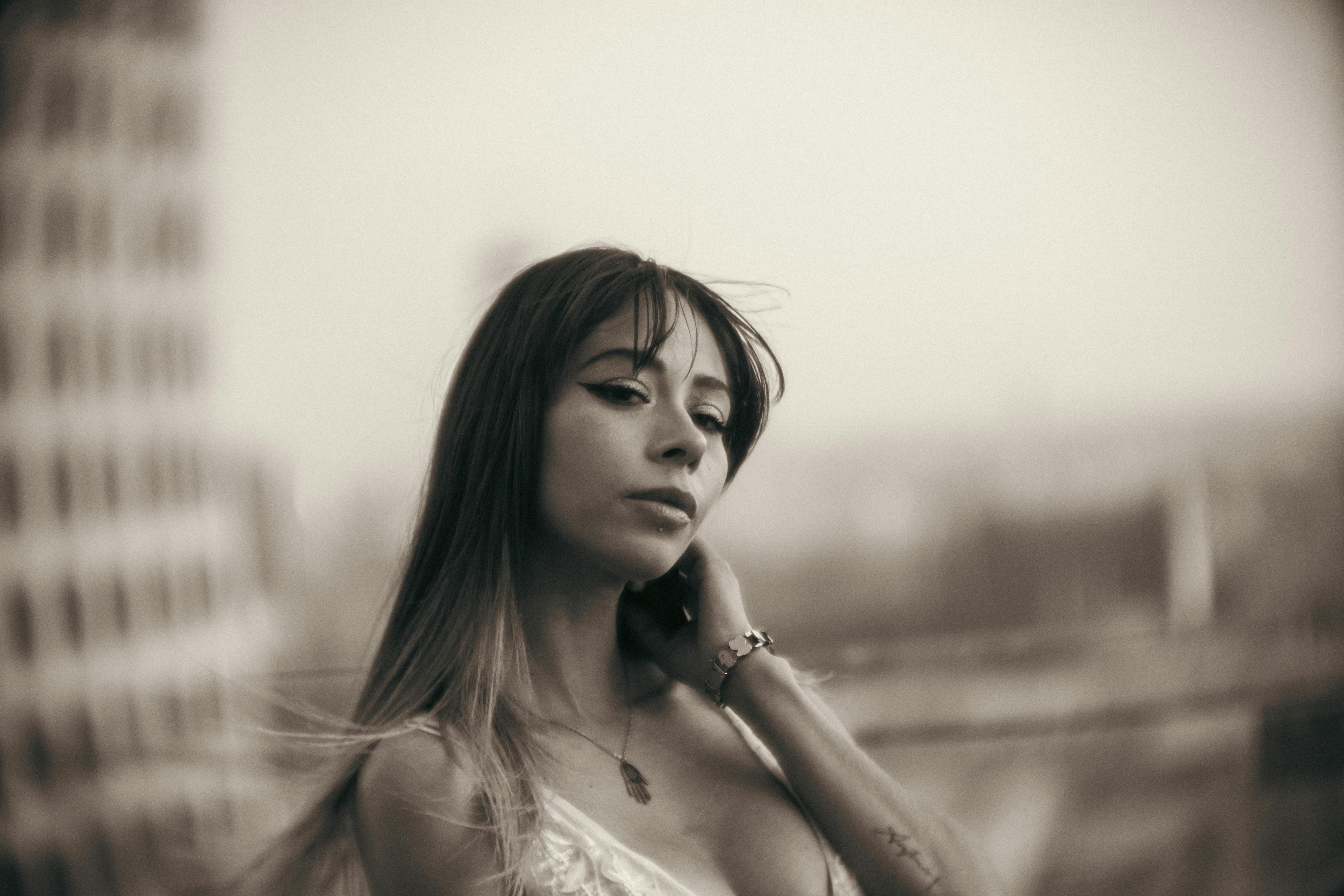 Portrait of a Beautiful Elegant Brunette Woman in Sepia · Free Stock Photo