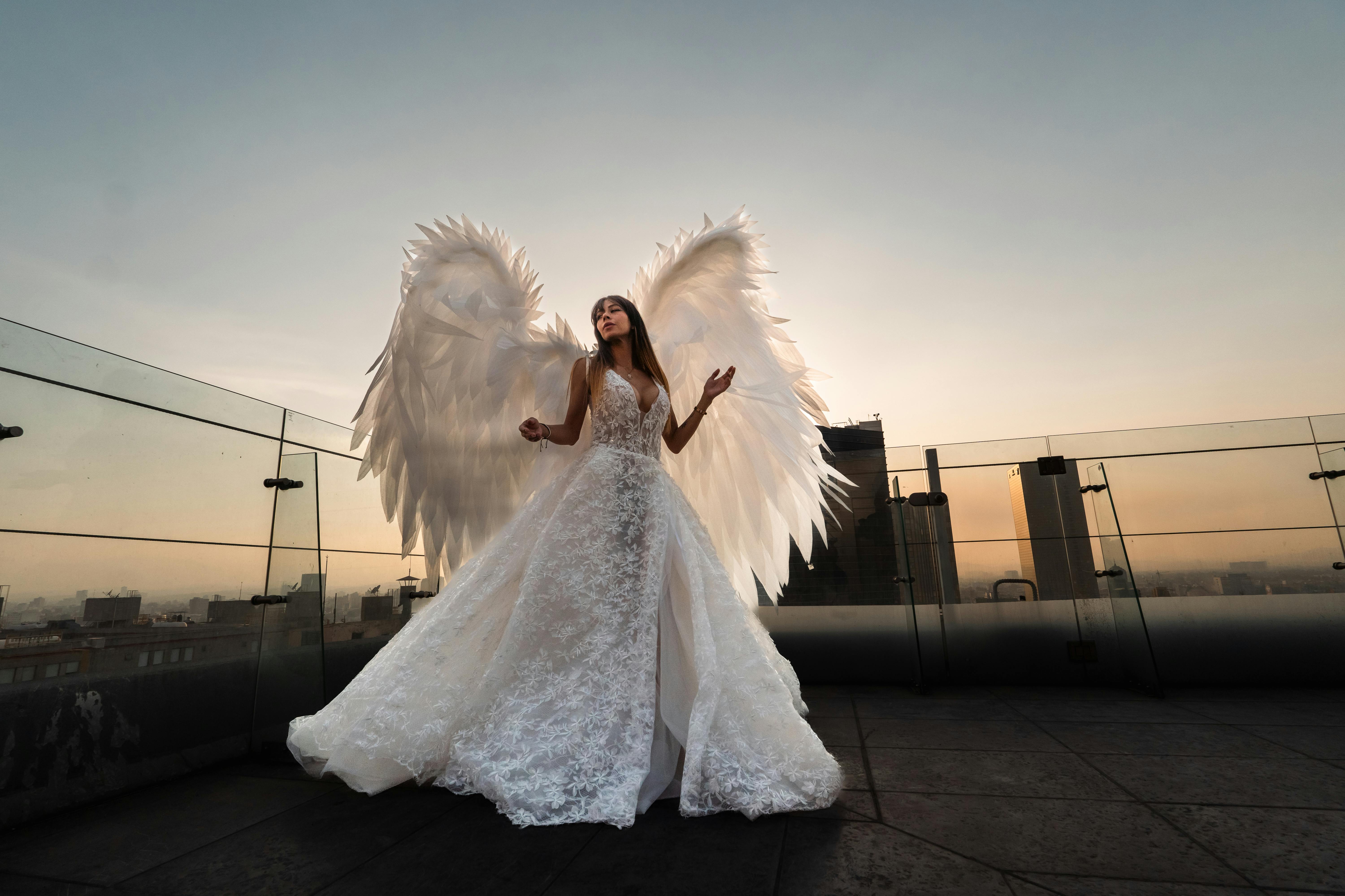 Woman in a Costume of an Angel Posing on a Terrace in a City · Free ...