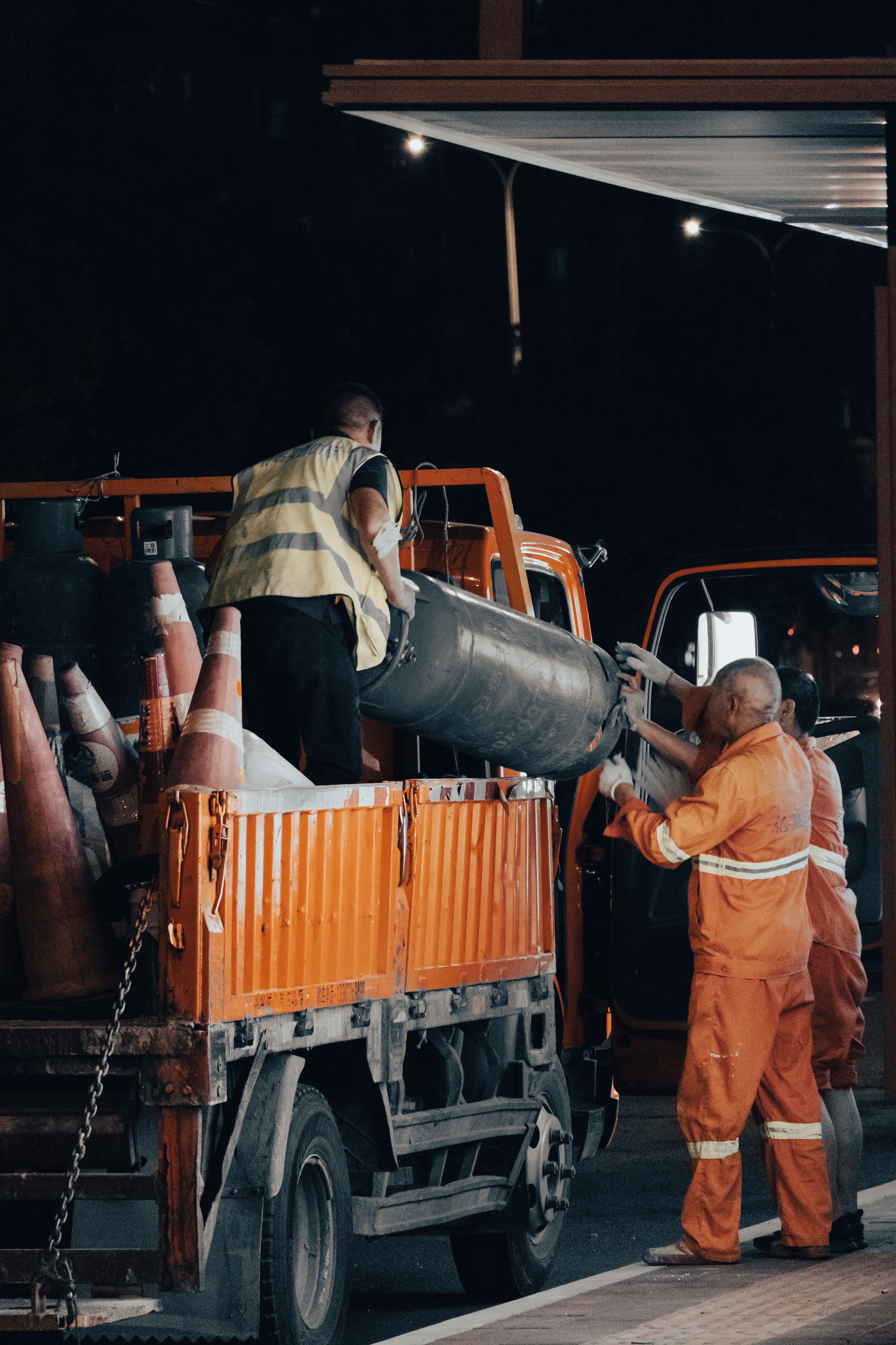 Road Service Workers Working at Night in City · Free Stock Photo