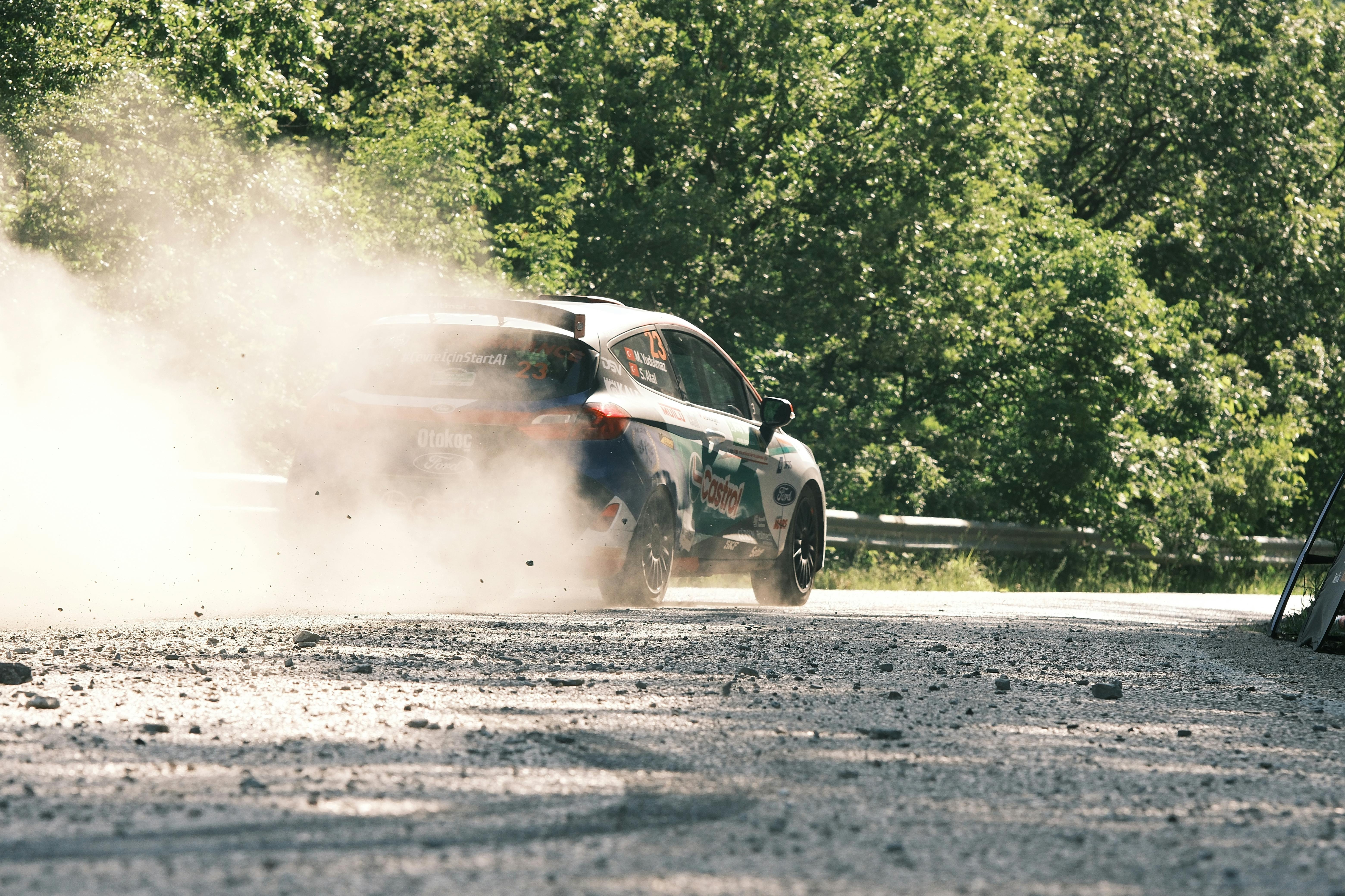 Rally Car Leaving Dust on a Dirt Road · Free Stock Photo