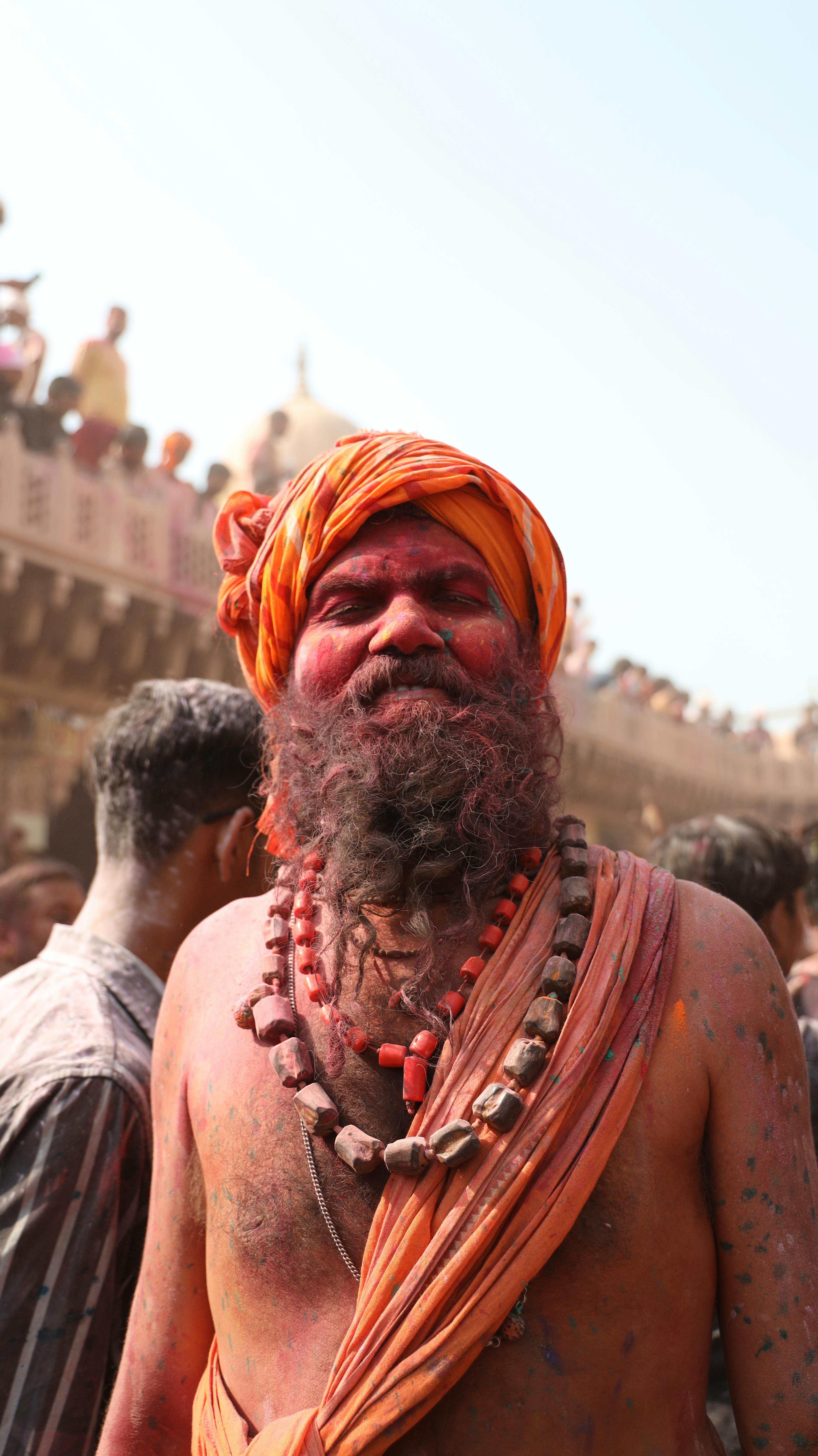 A man with red face and orange beard at the temple · Free Stock Photo