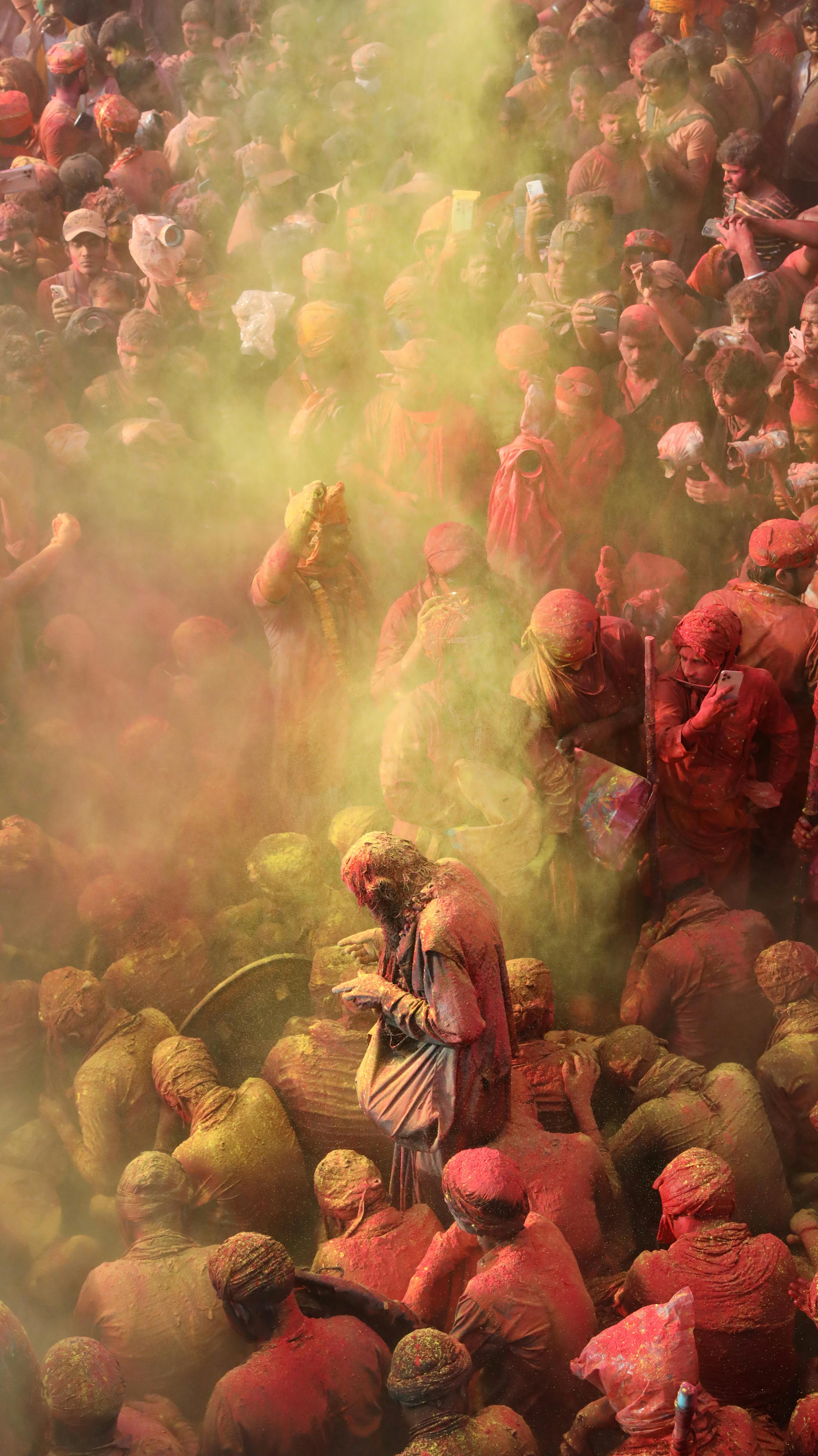 People Throwing Blue Powder at Daytime · Free Stock Photo