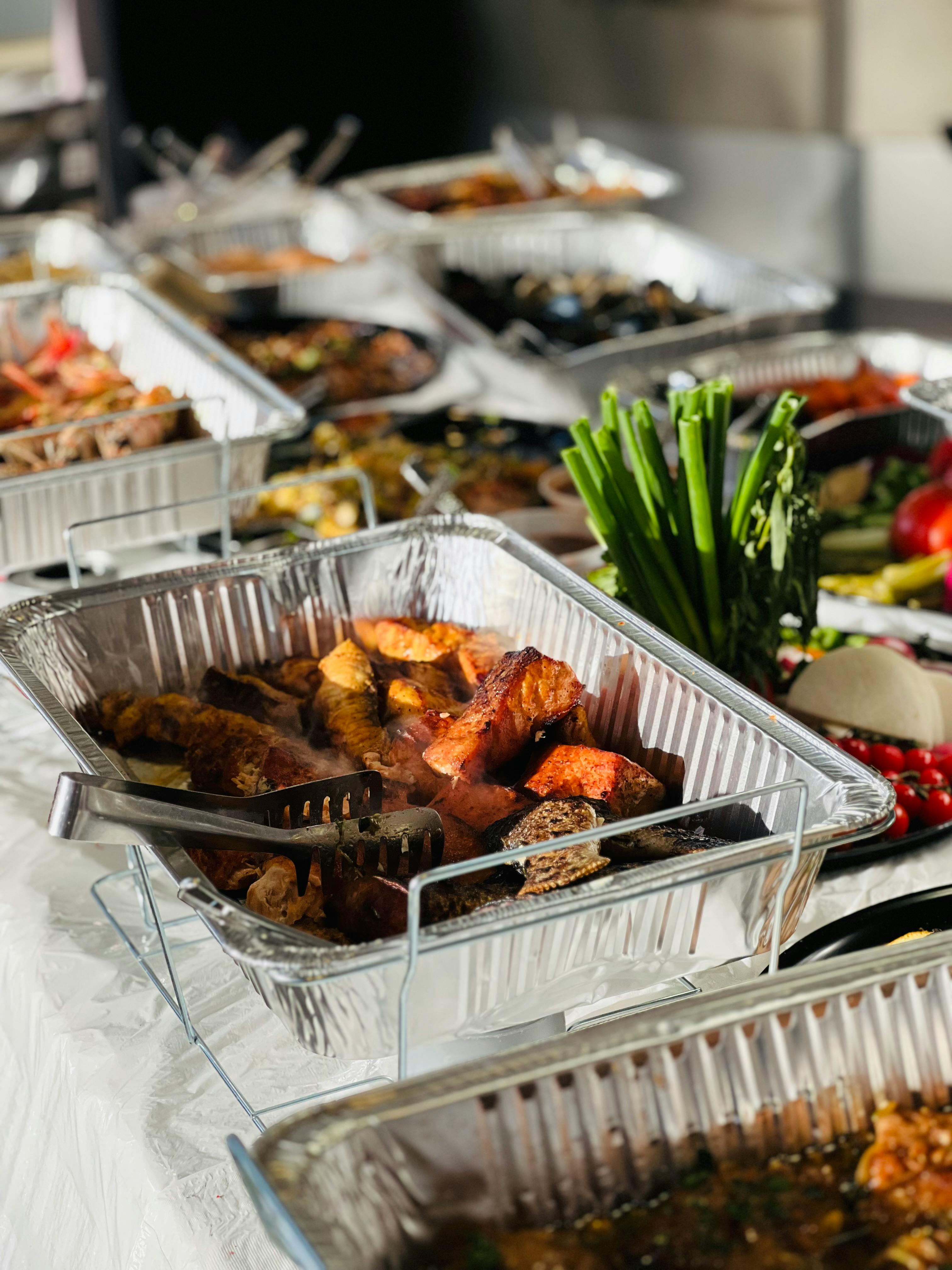 Pan with Cooked Meat on a Buffet Table · Free Stock Photo