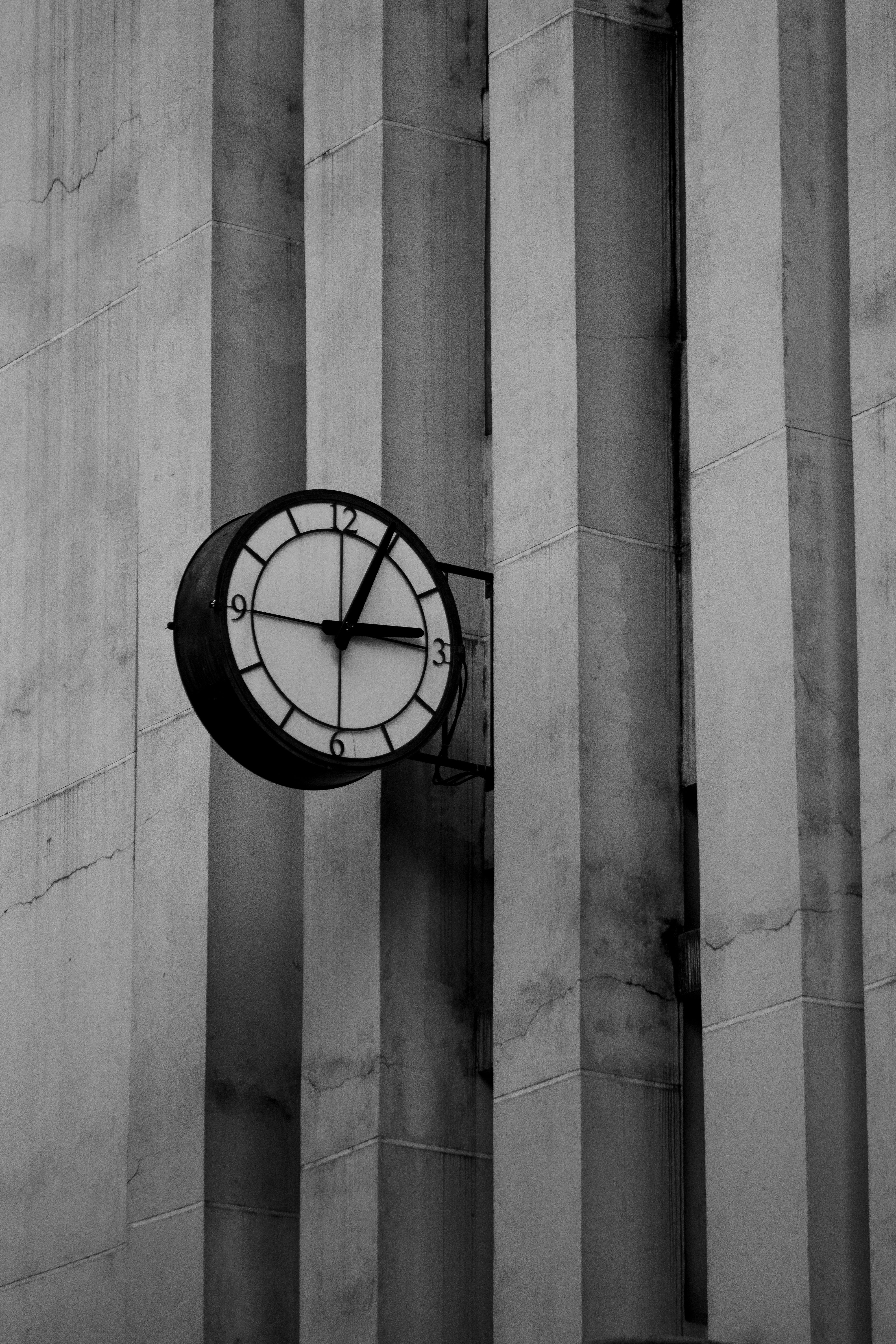 Black and White Shot of a Clock on a Building Facade · Free Stock Photo