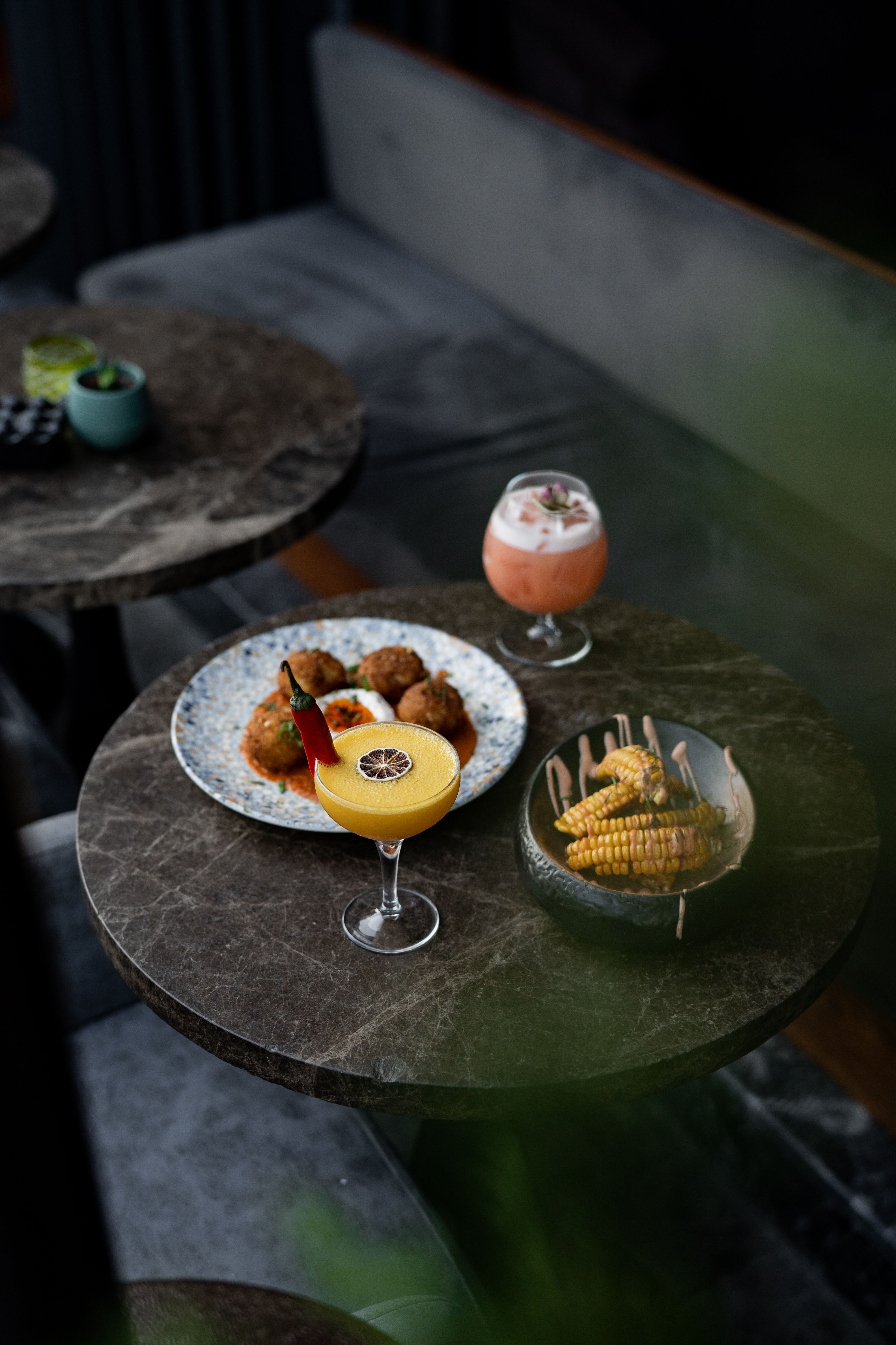 A table with two plates of food and drinks · Free Stock Photo