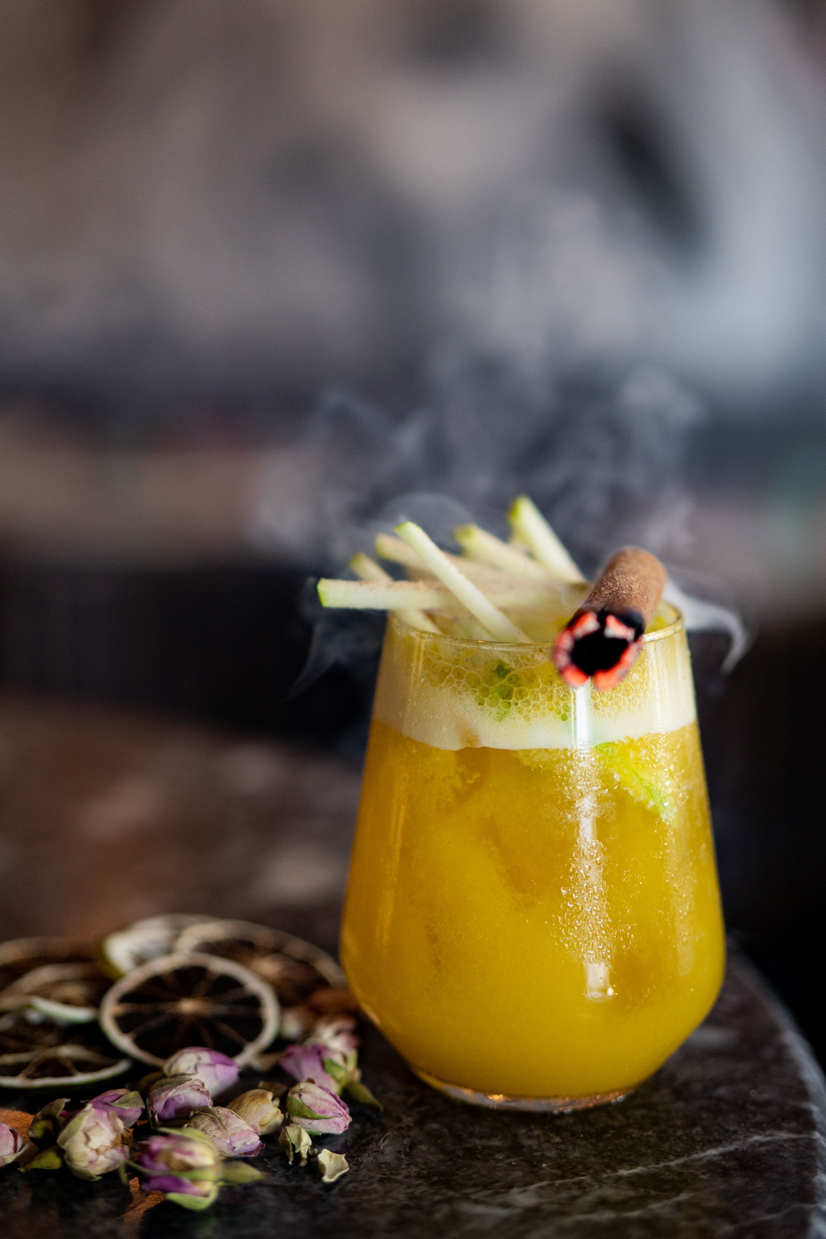 A cocktail with smoke coming out of it · Free Stock Photo