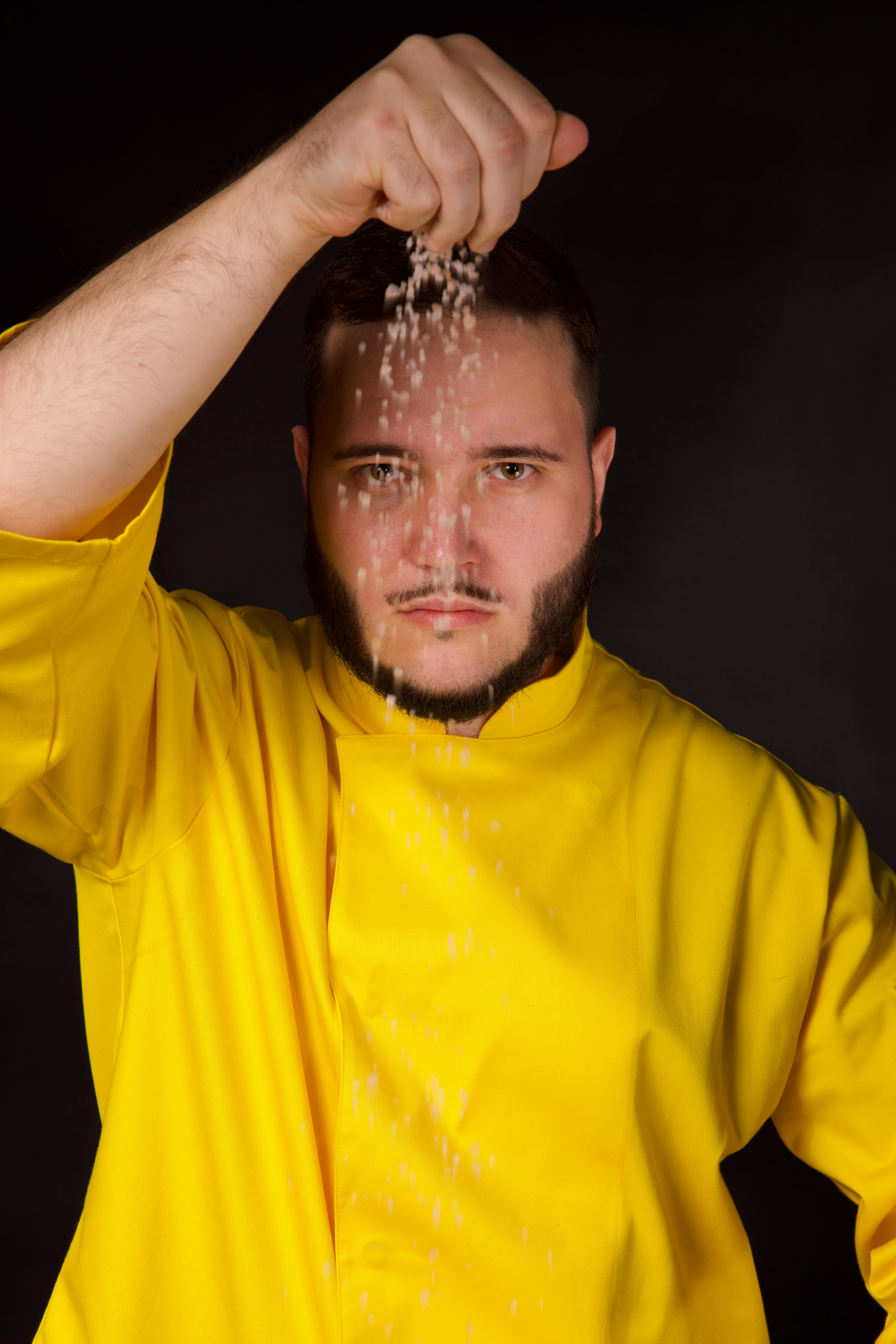 Seeds Falling Down from Raised Arm of Cook · Free Stock Photo