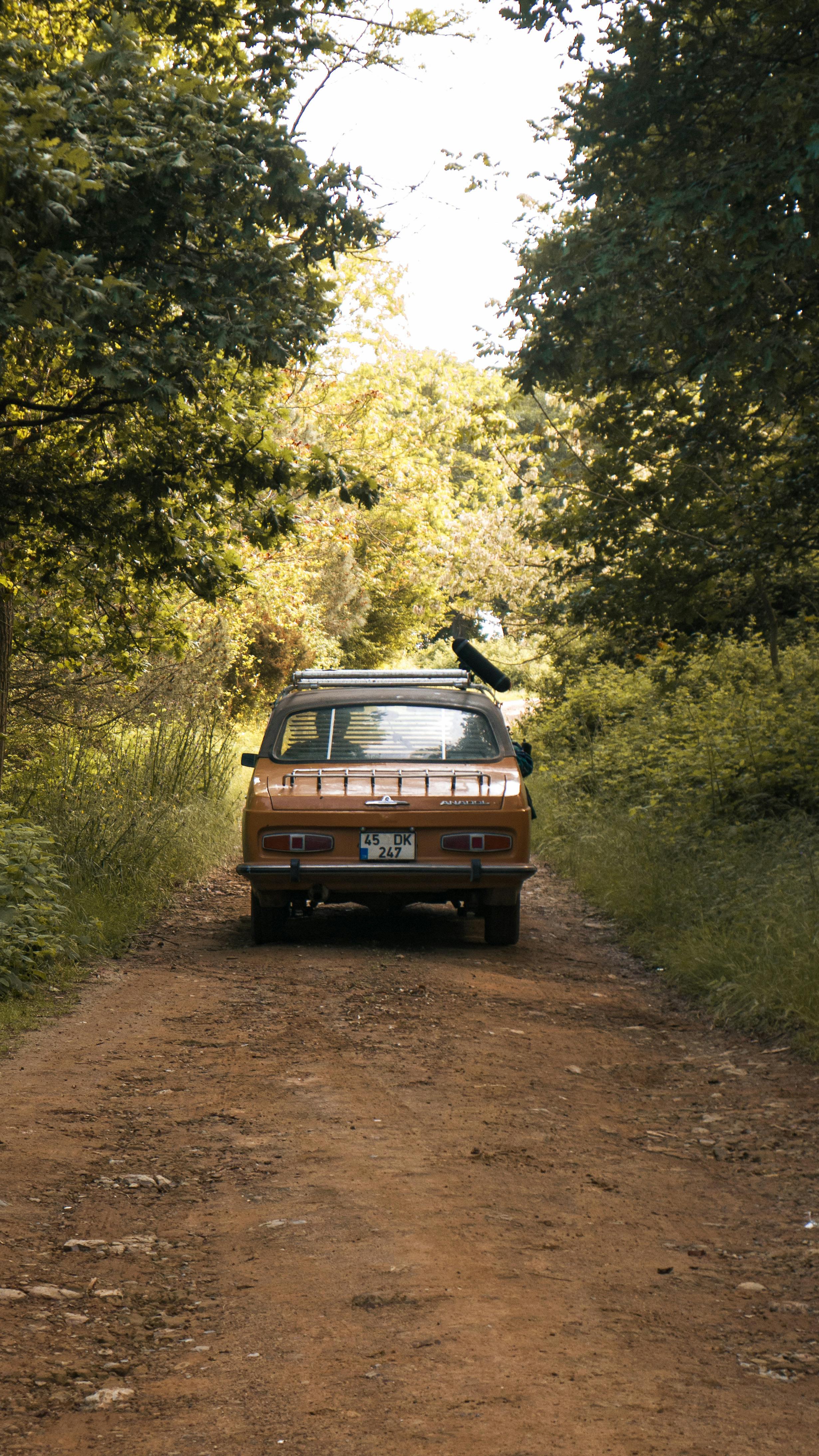 Retro Car Driving on a Roud on the Countryside · Free Stock Photo