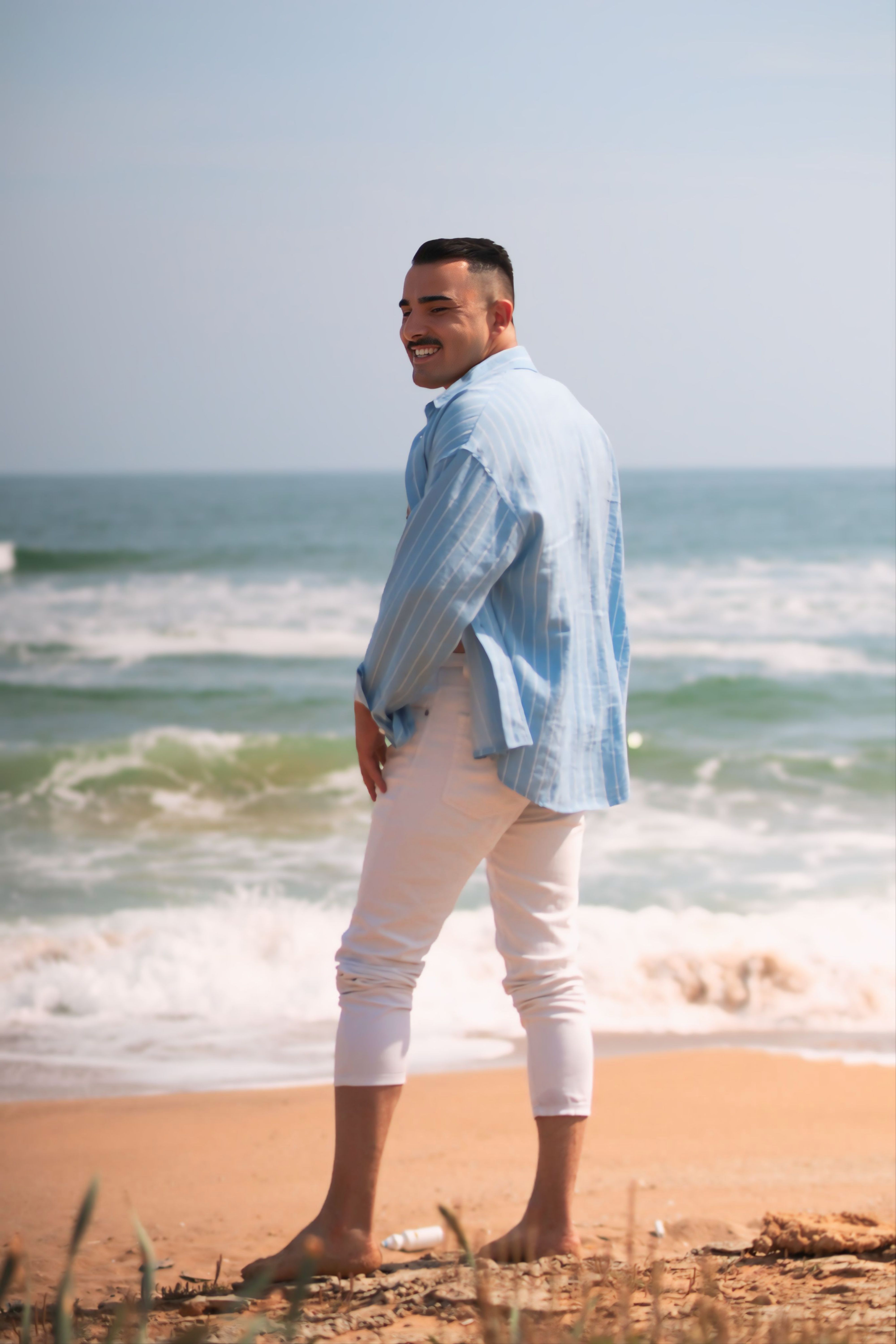 Brunette Man in Blue Shirt on Beach · Free Stock Photo