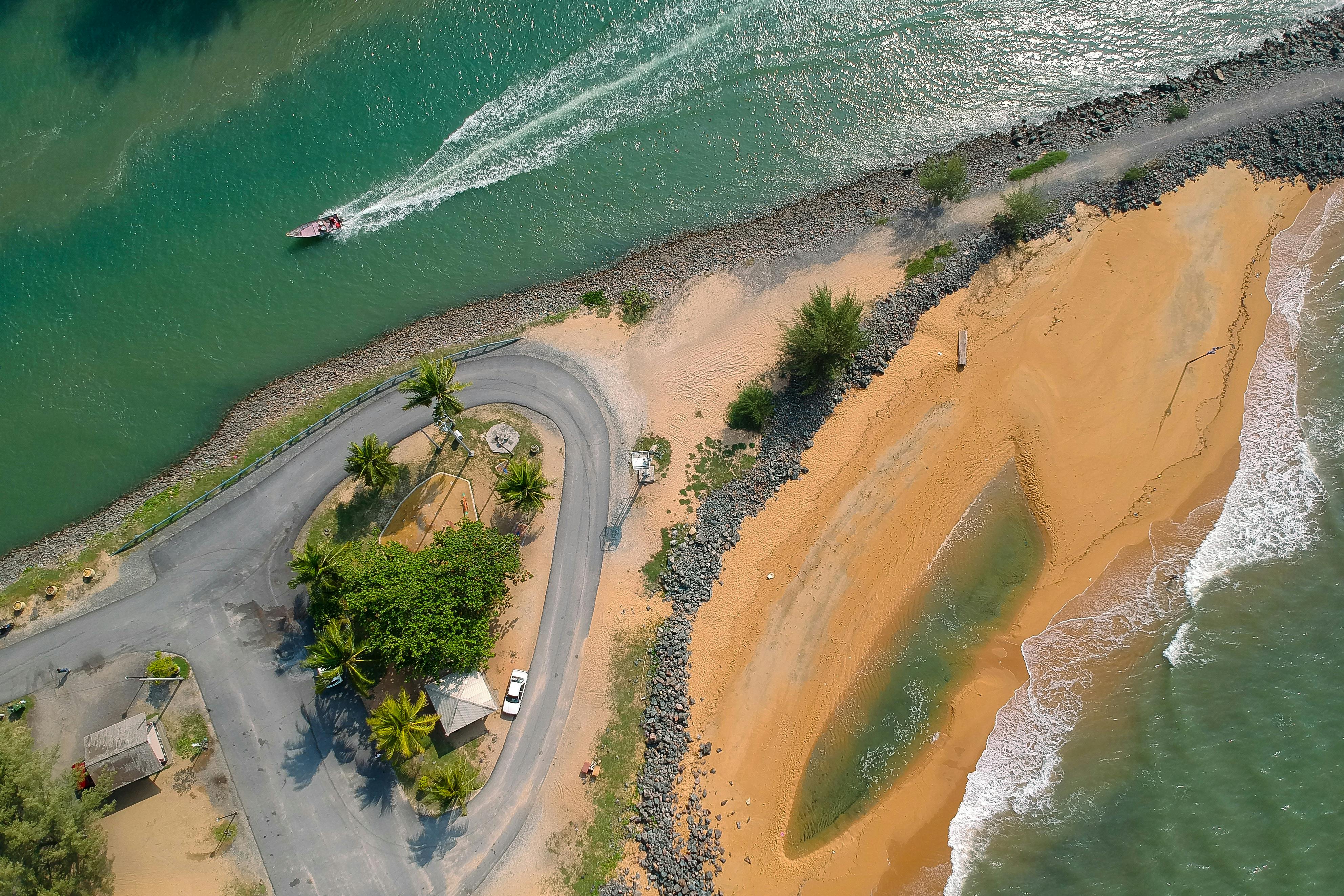 Aerial View of Ocean and Curved Road · Free Stock Photo
