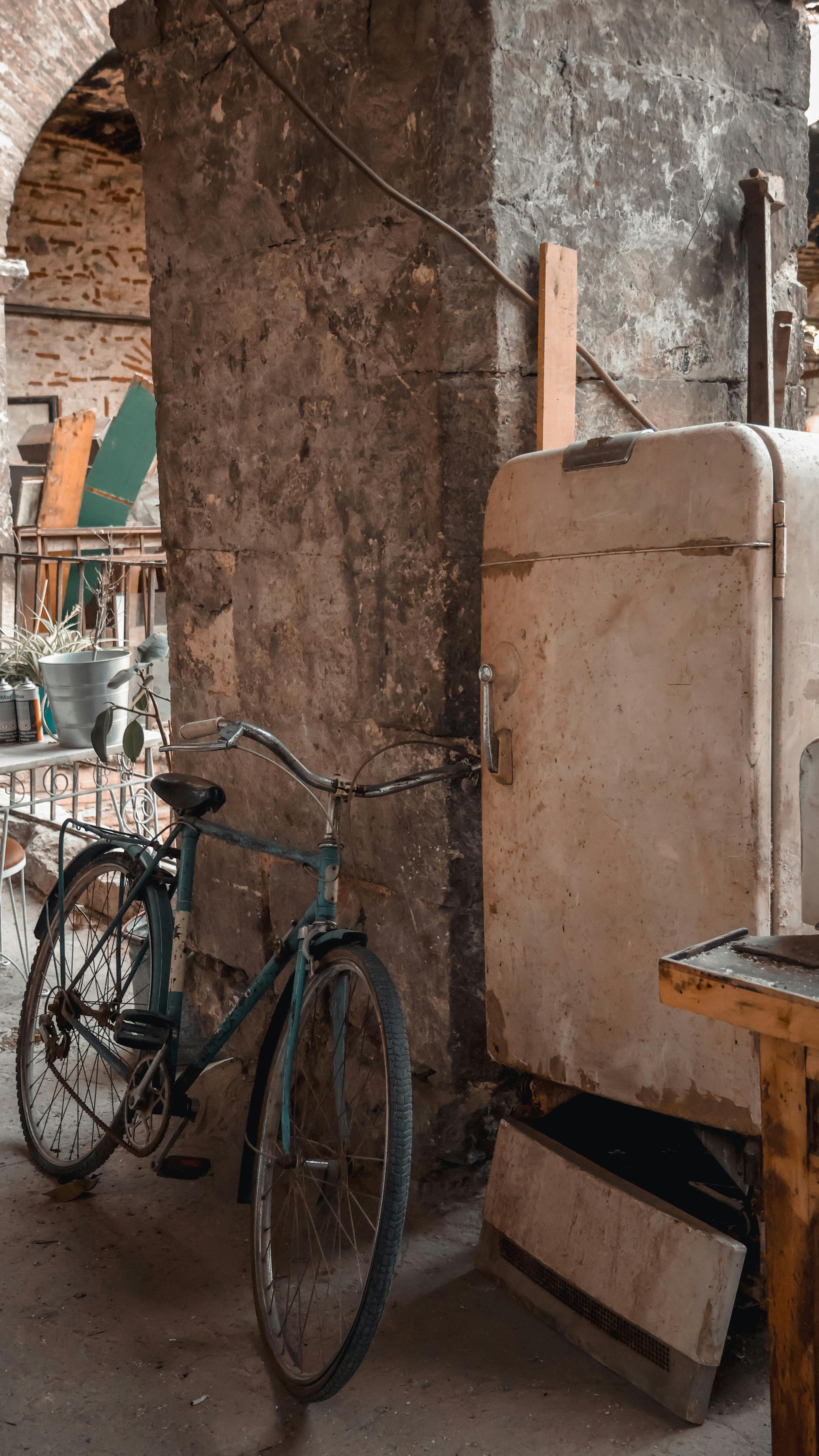 Vintage Bicycle and Old Refrigerator in a Rustic Workshop · Free Stock ...