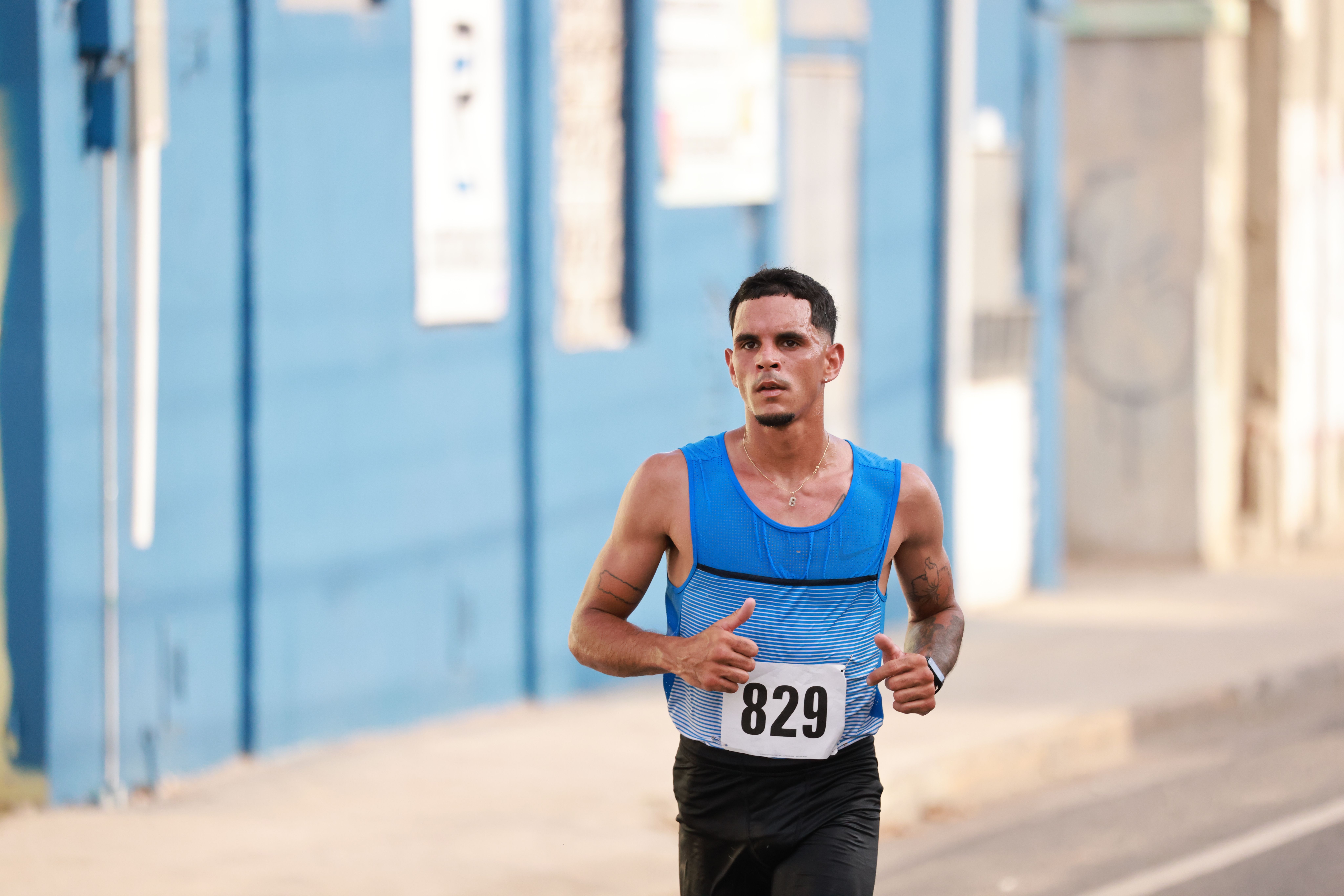 A Man Running in a Marathon · Free Stock Photo