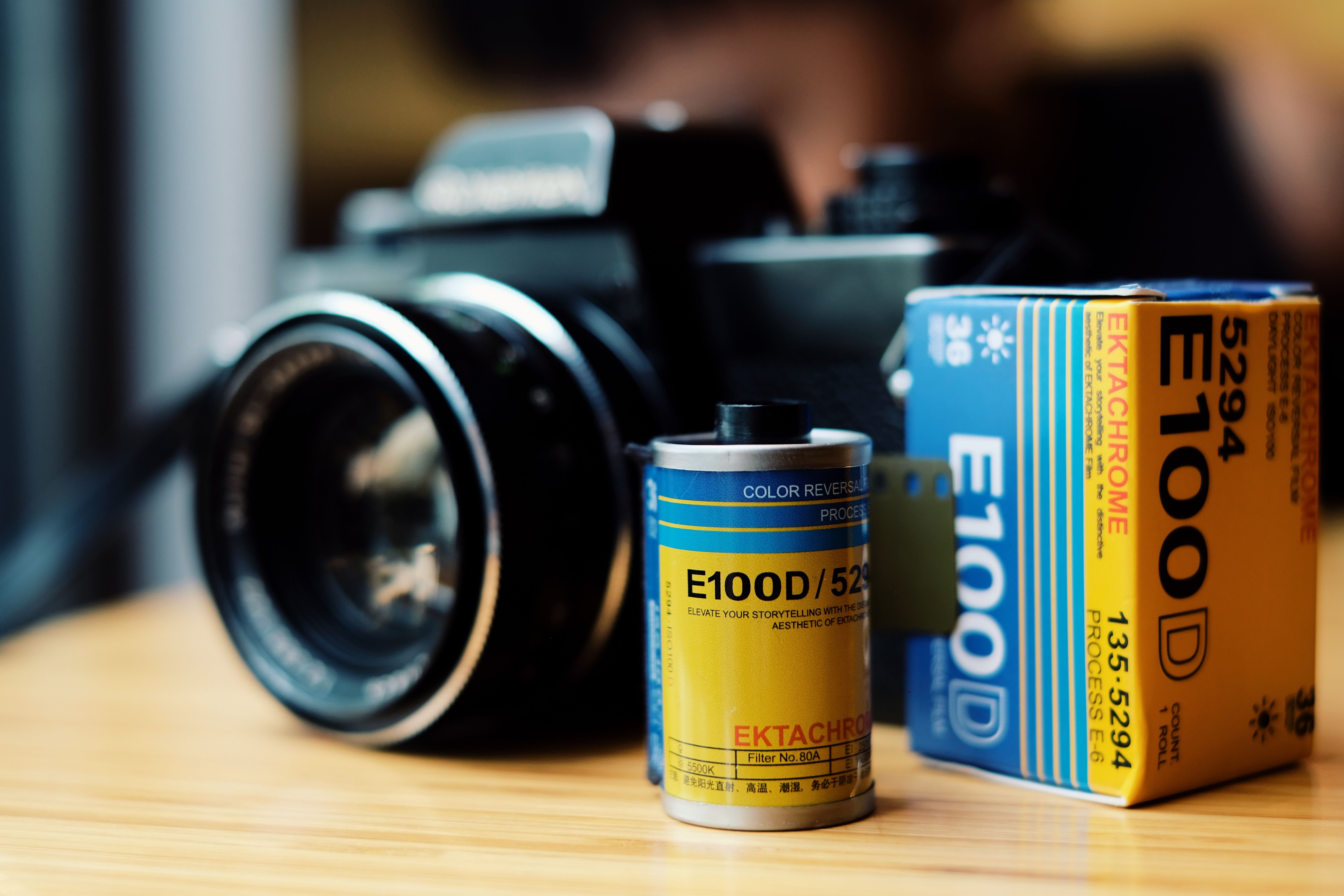 Close up of a Camera and a Film Roll · Free Stock Photo