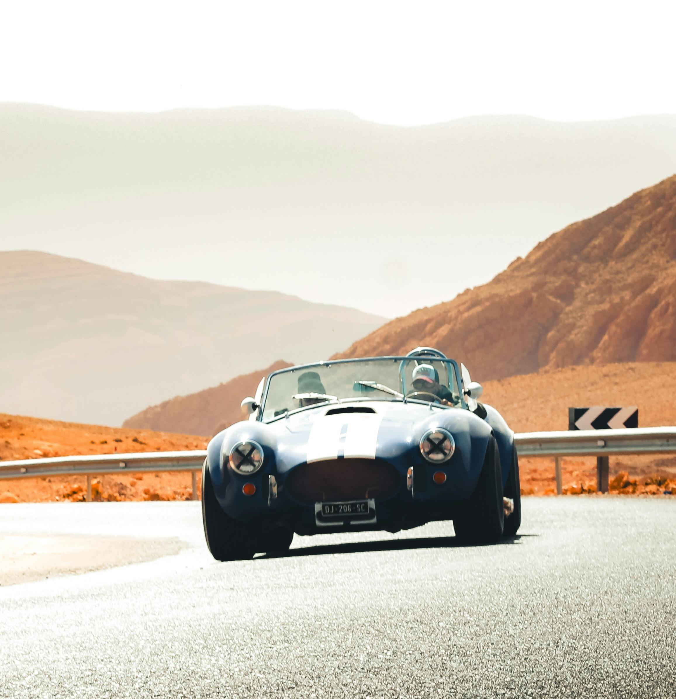 Man Driving Shelby Cobra on Road · Free Stock Photo