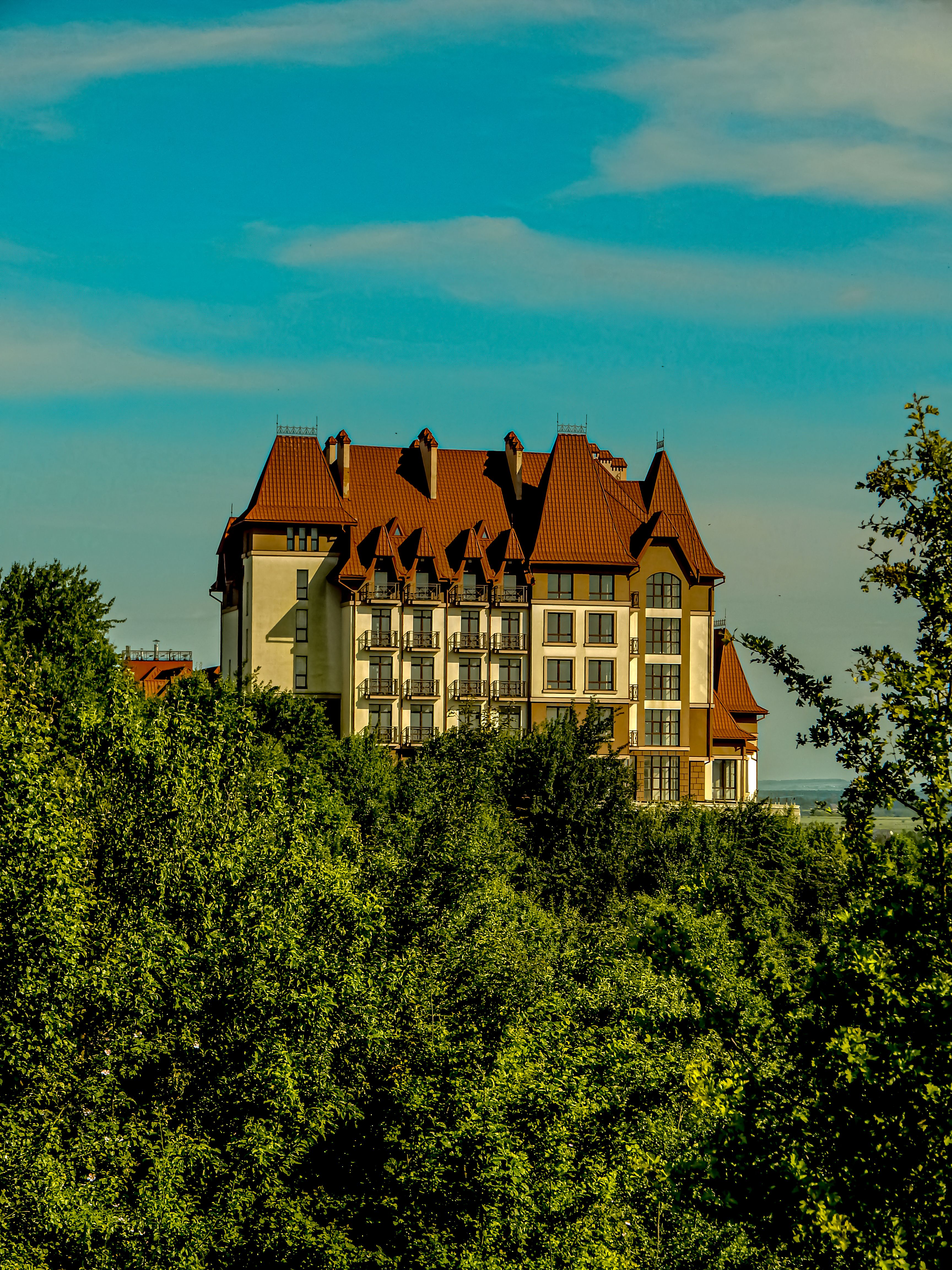 A large building on top of a hill · Free Stock Photo
